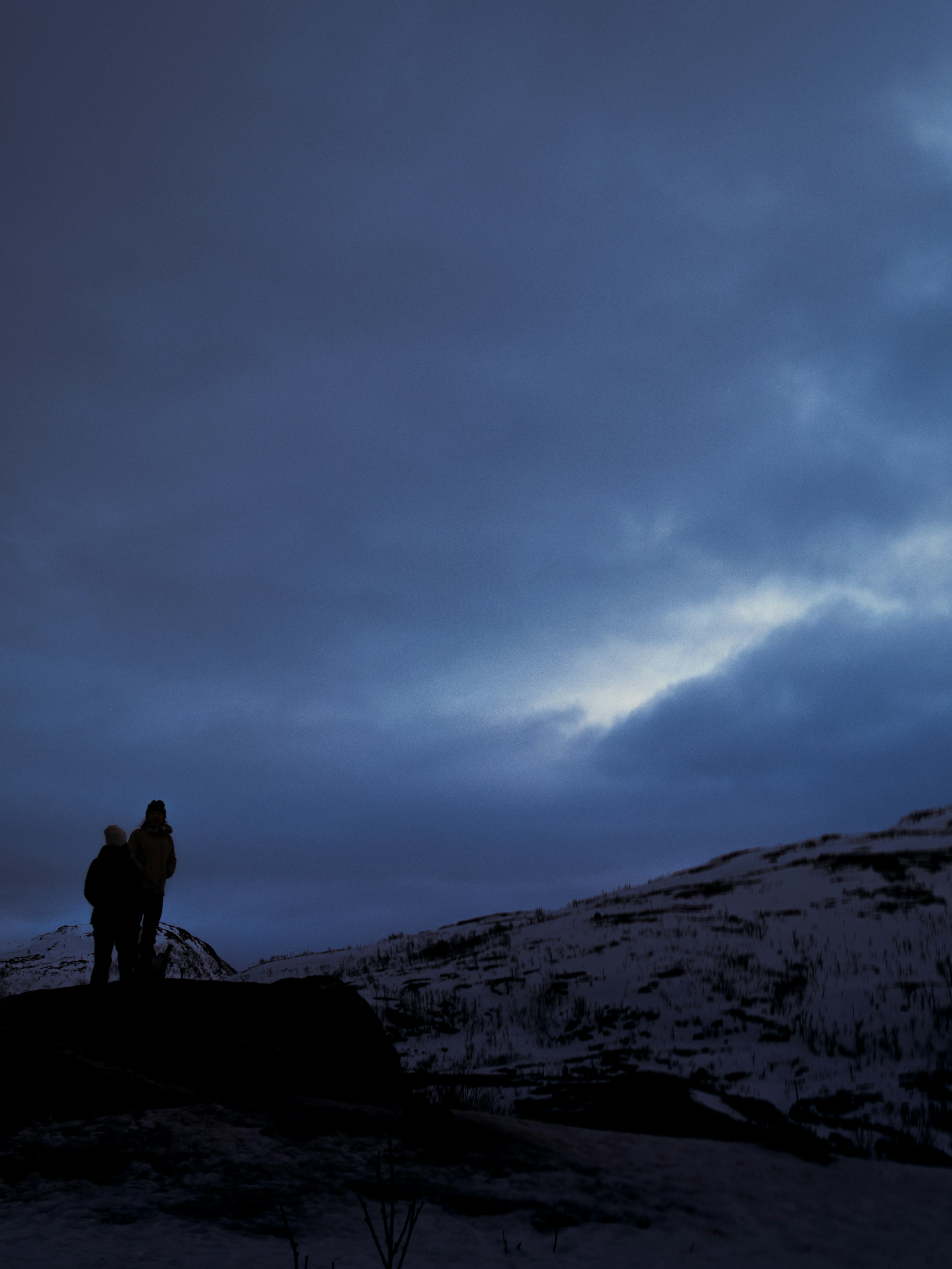 A couple of people standing on top of a snow covered slope photo – Free ...