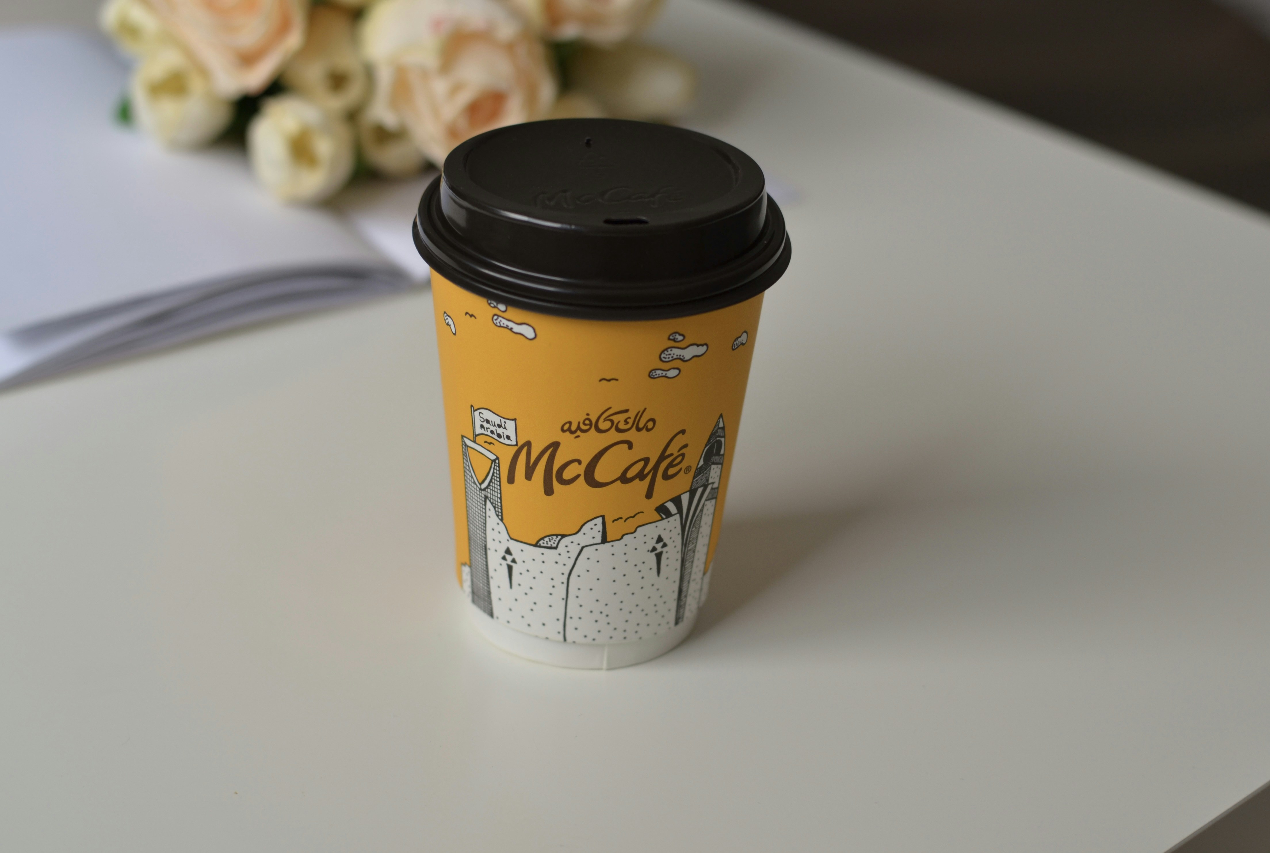 Quiet Café Moment: McCafé Cup on a Minimal White Table