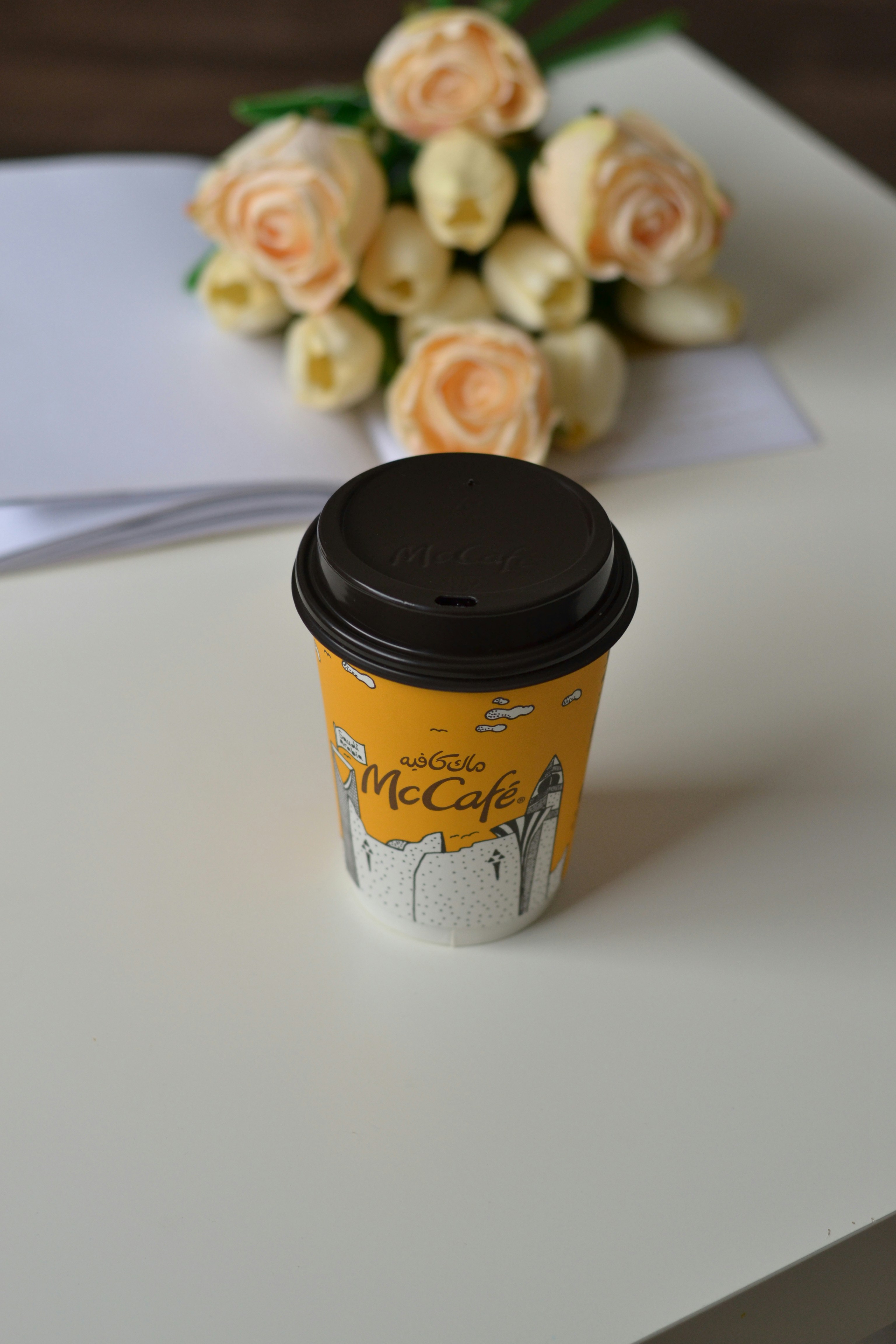 Morning Brew Beneath a Bouquet of Roses