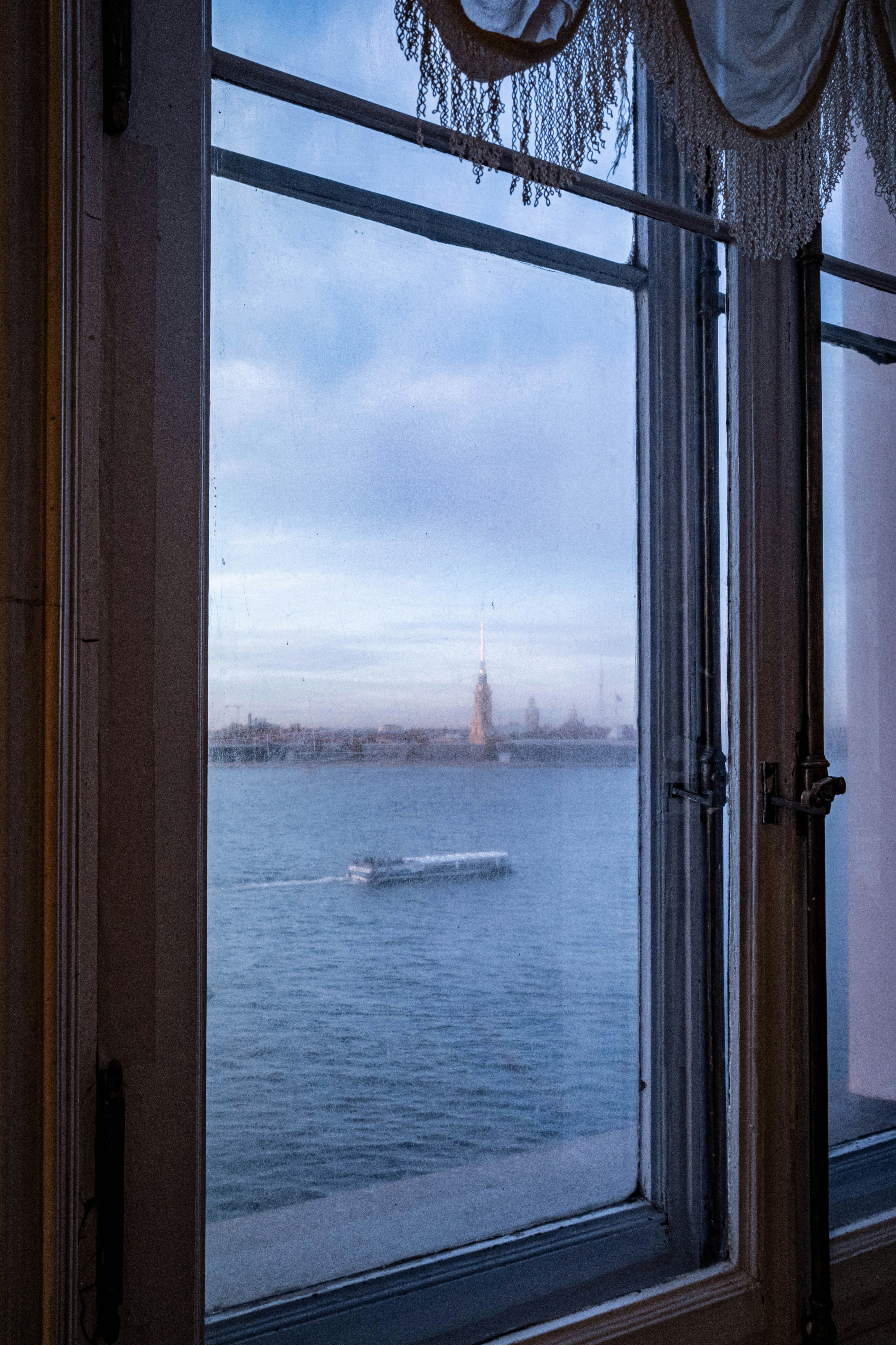Framed Horizon: River View Through an Old WindowLKHTK