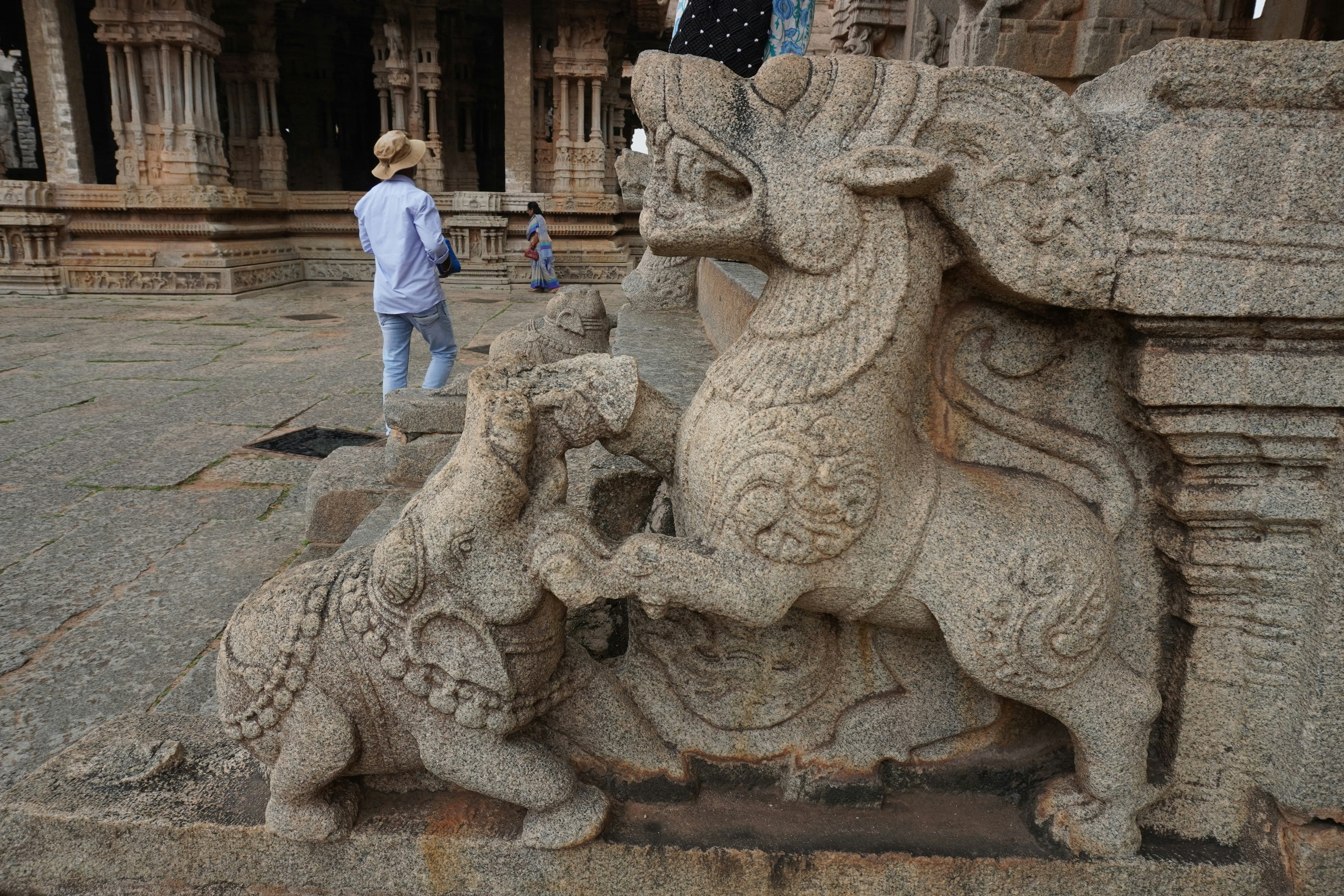 Stone Guardians: A Carved Dragon and Its Silent Sentinel