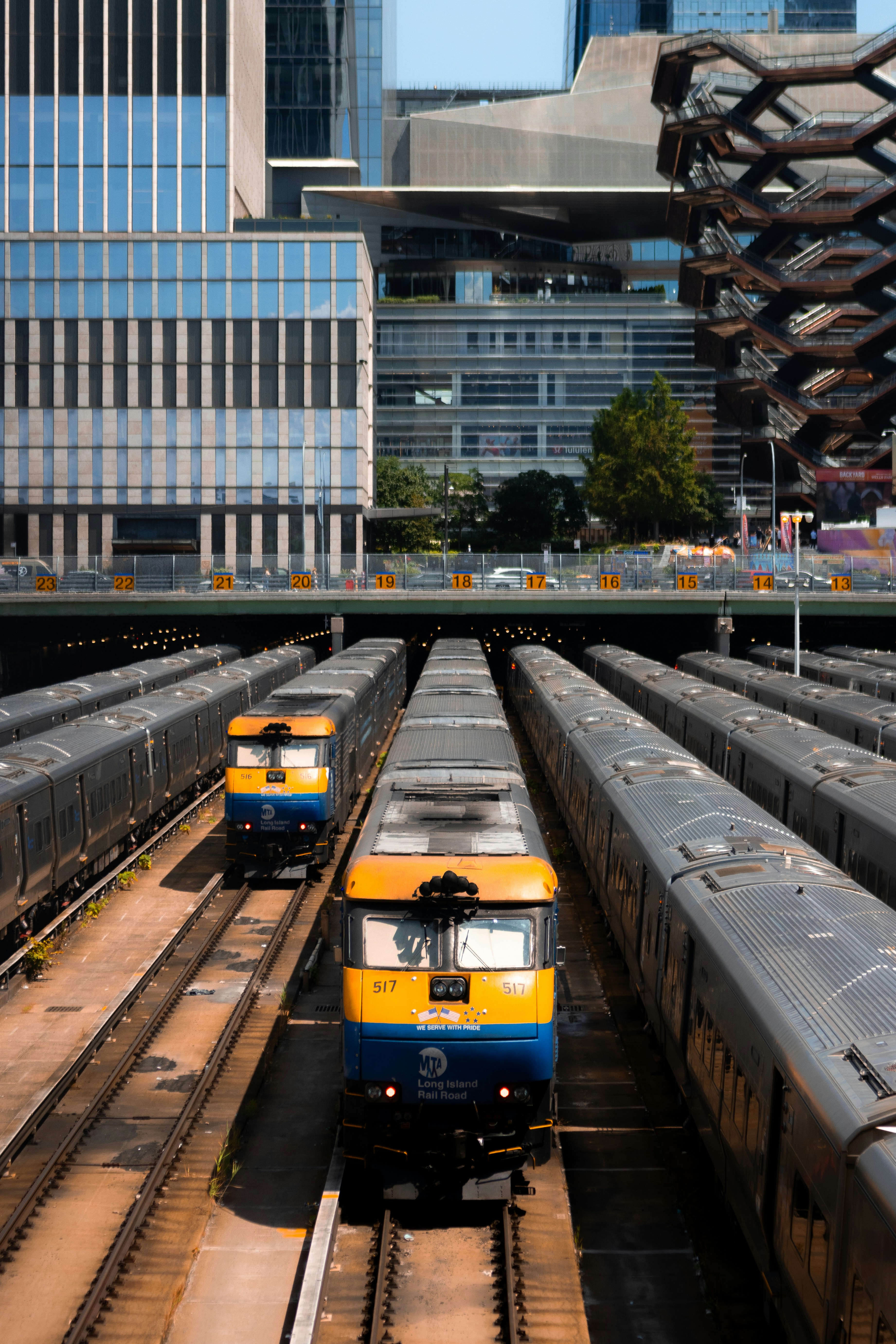 A group of trains that are sitting on the tracks photo – Free New york ...