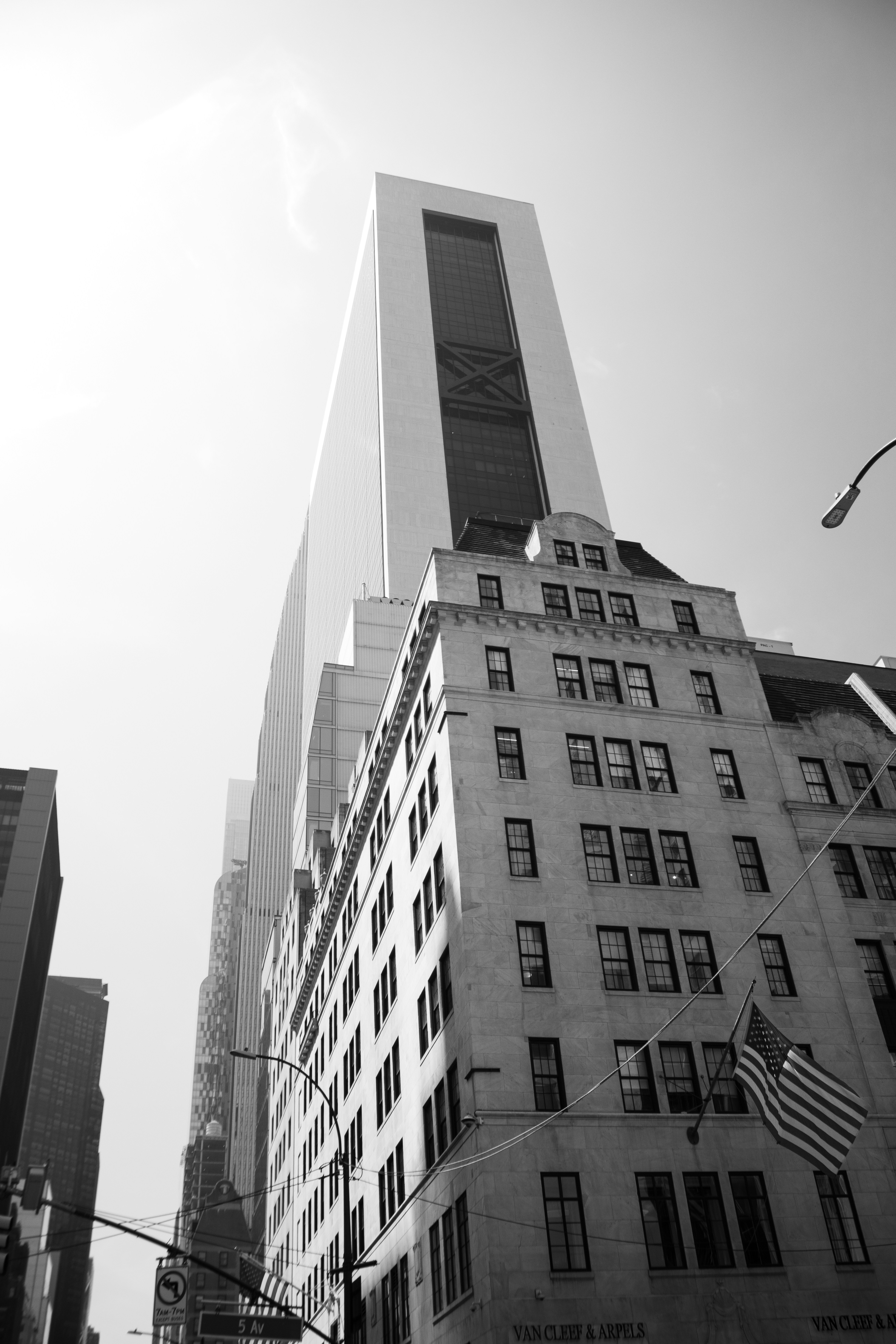 Skyward Echoes: A Monochrome Confrontation of Brick and Glass