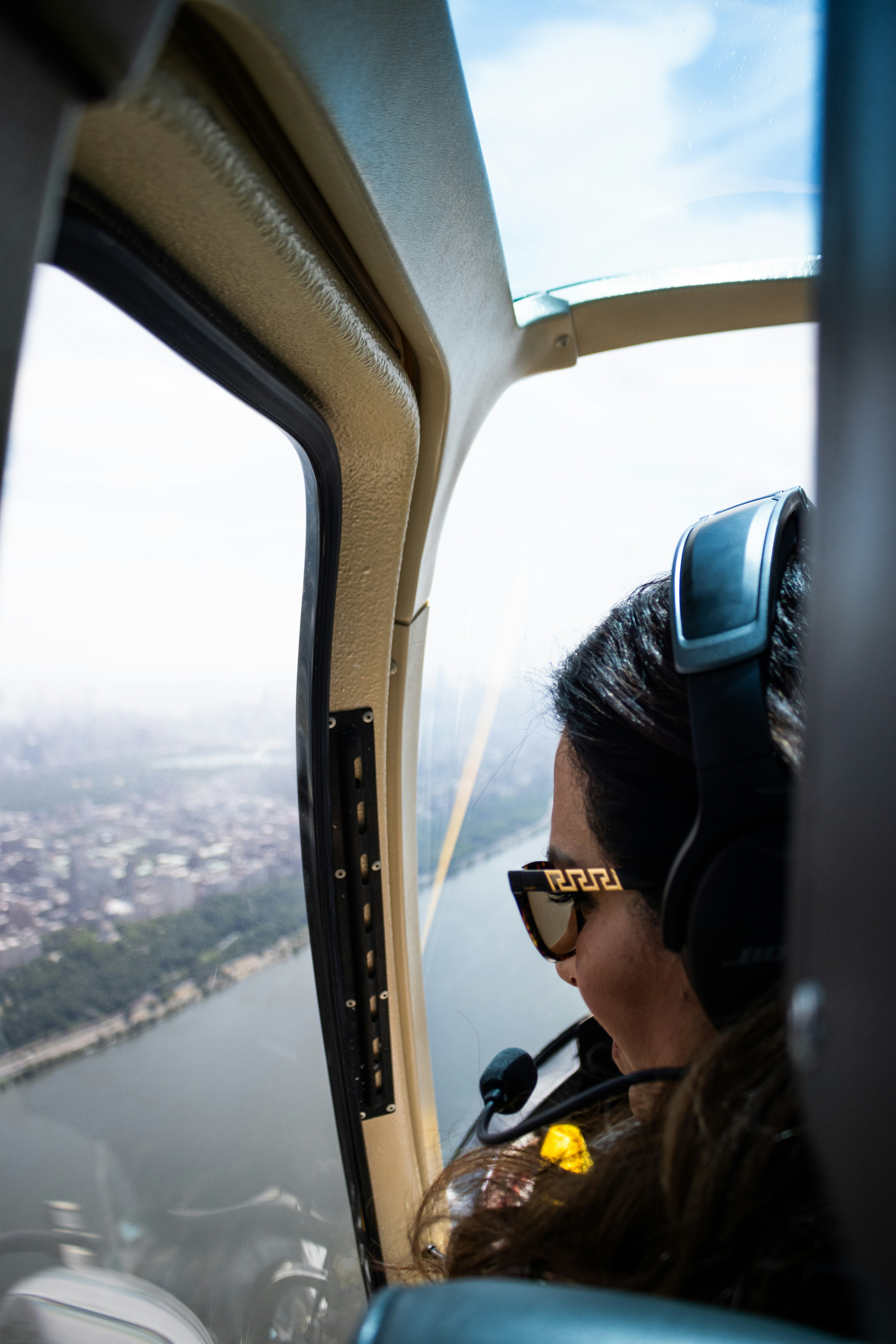 Window Seat Perspective: Portrait of a Pilot Over the Riverbend City
