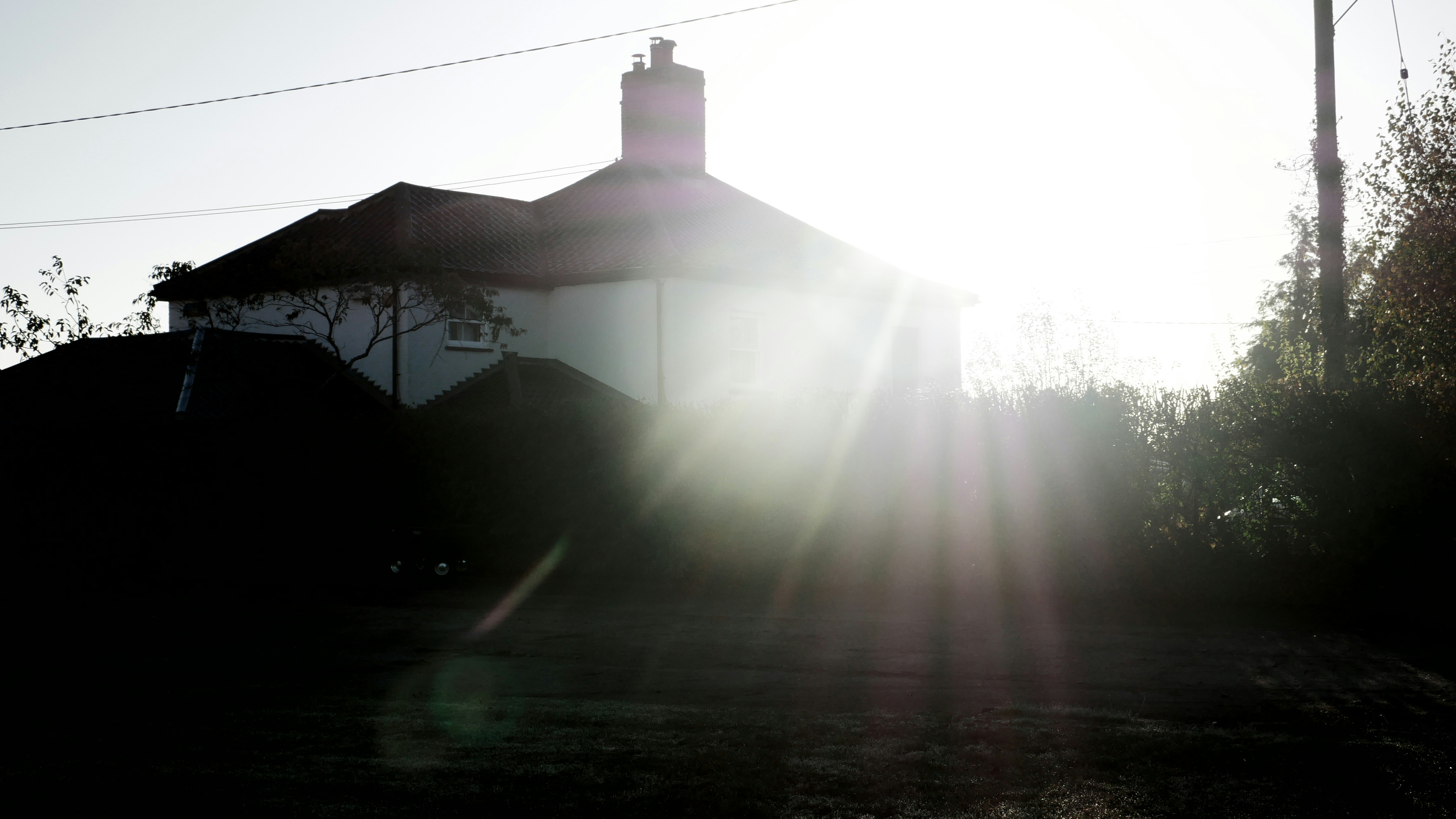 The sun is shining brightly over a house photo – Free Sunrise Image on ...