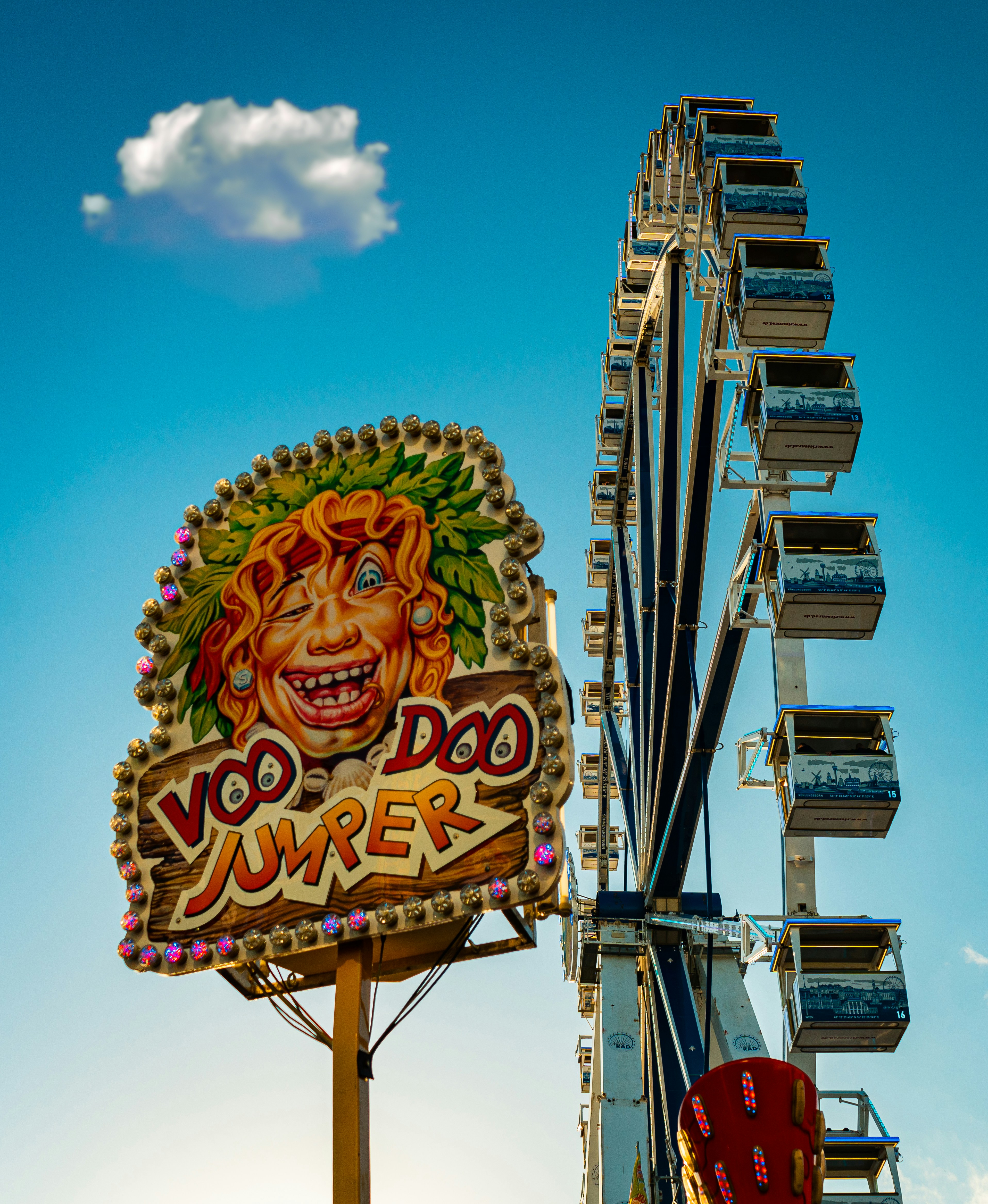 A ferris wheel with a sign for a carnival photo – Free Bremen Image on ...