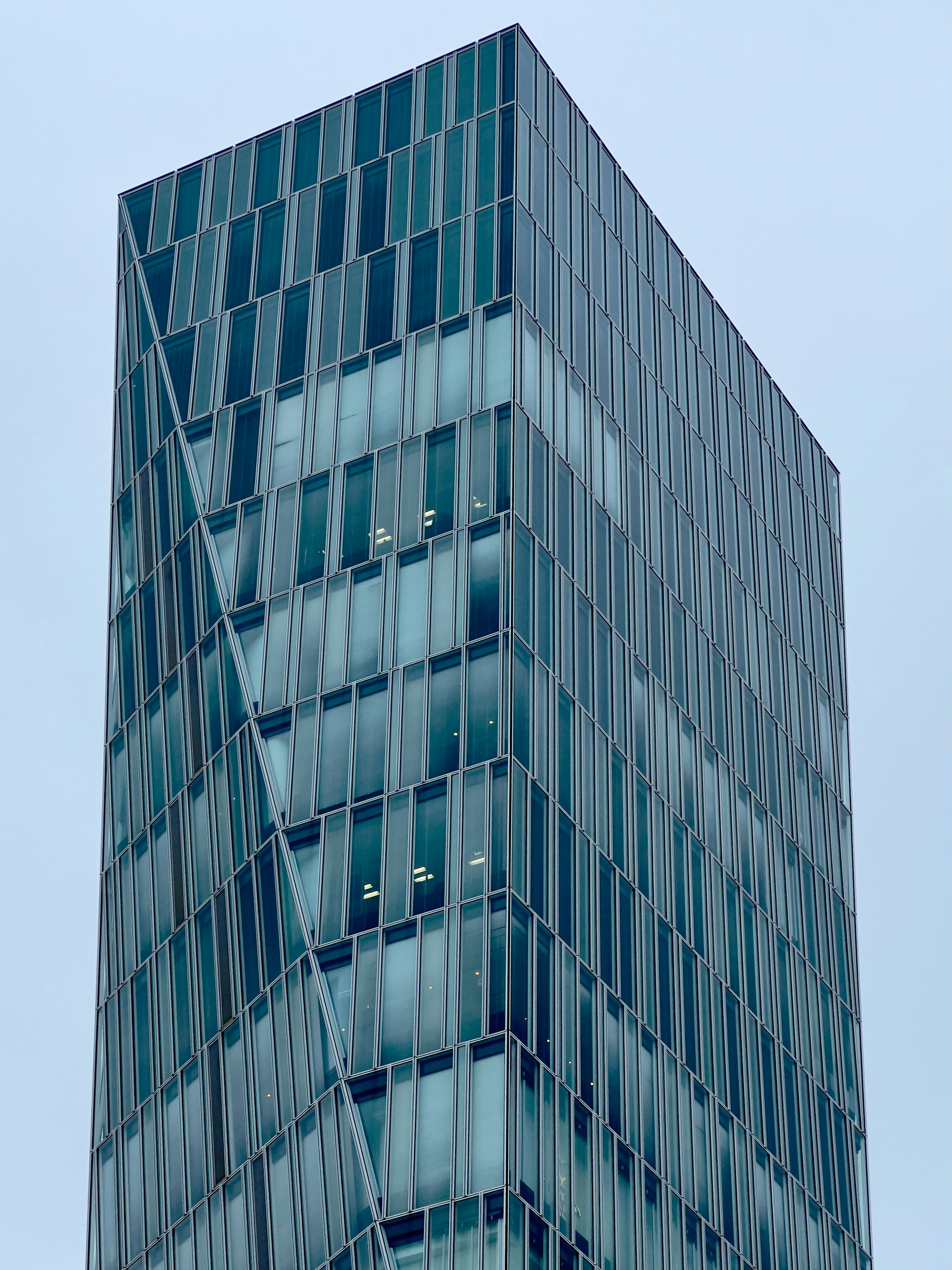 A very tall building with many windows on top of it photo – Free ...