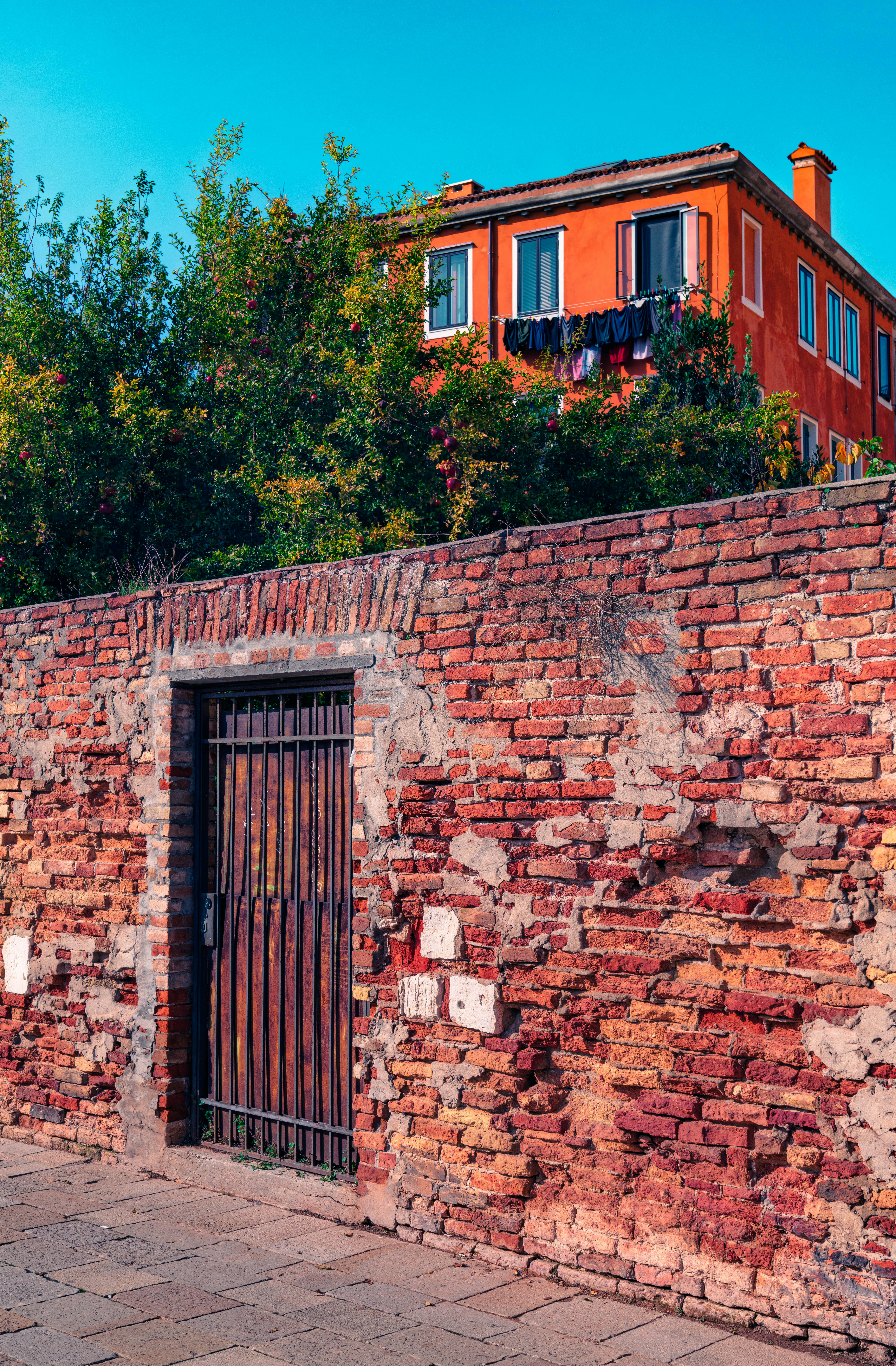 Brick Gate Under a Sunset-Orange Terrace