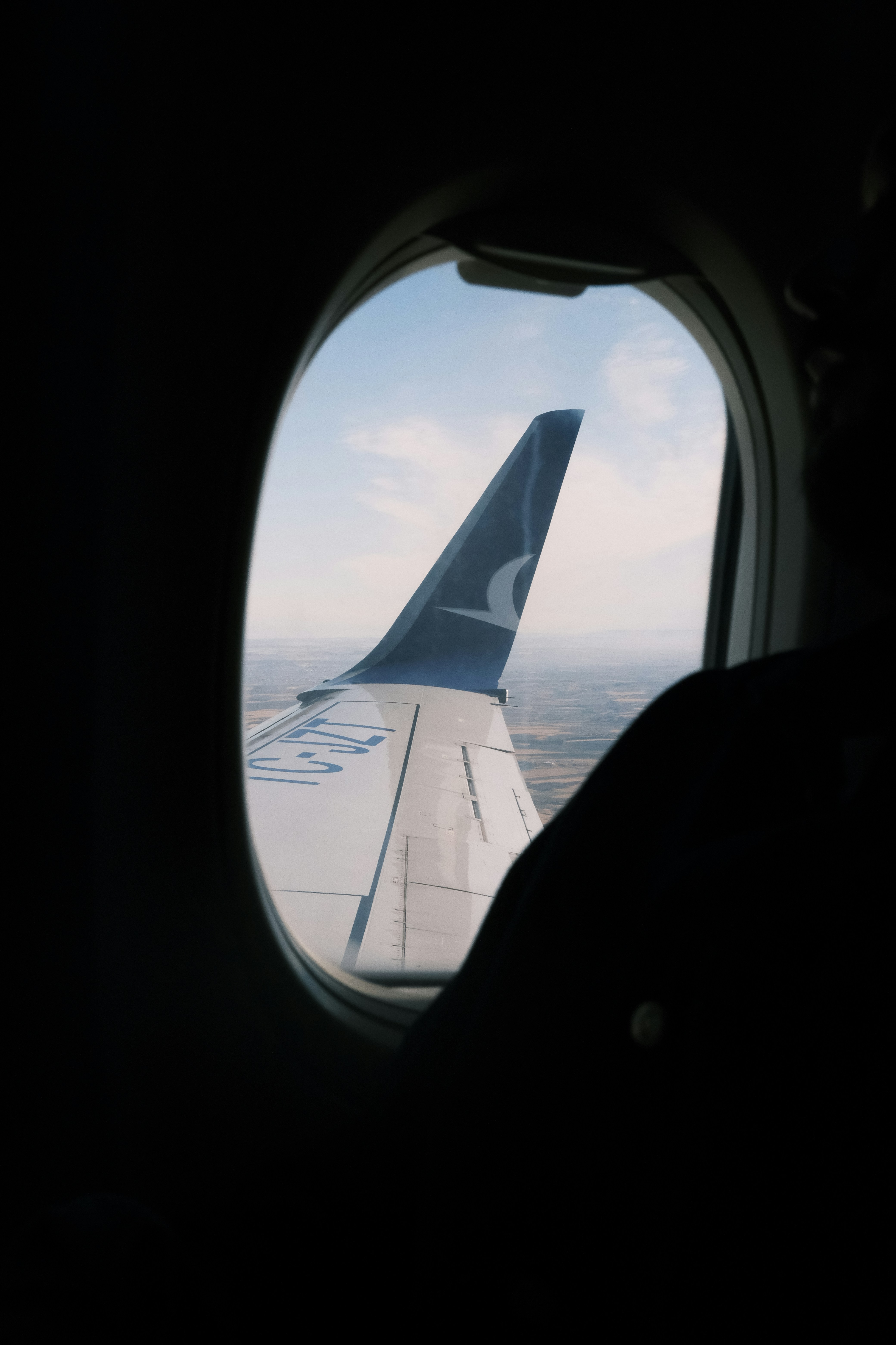 A view of the wing of an airplane through a window photo – Free Blue ...