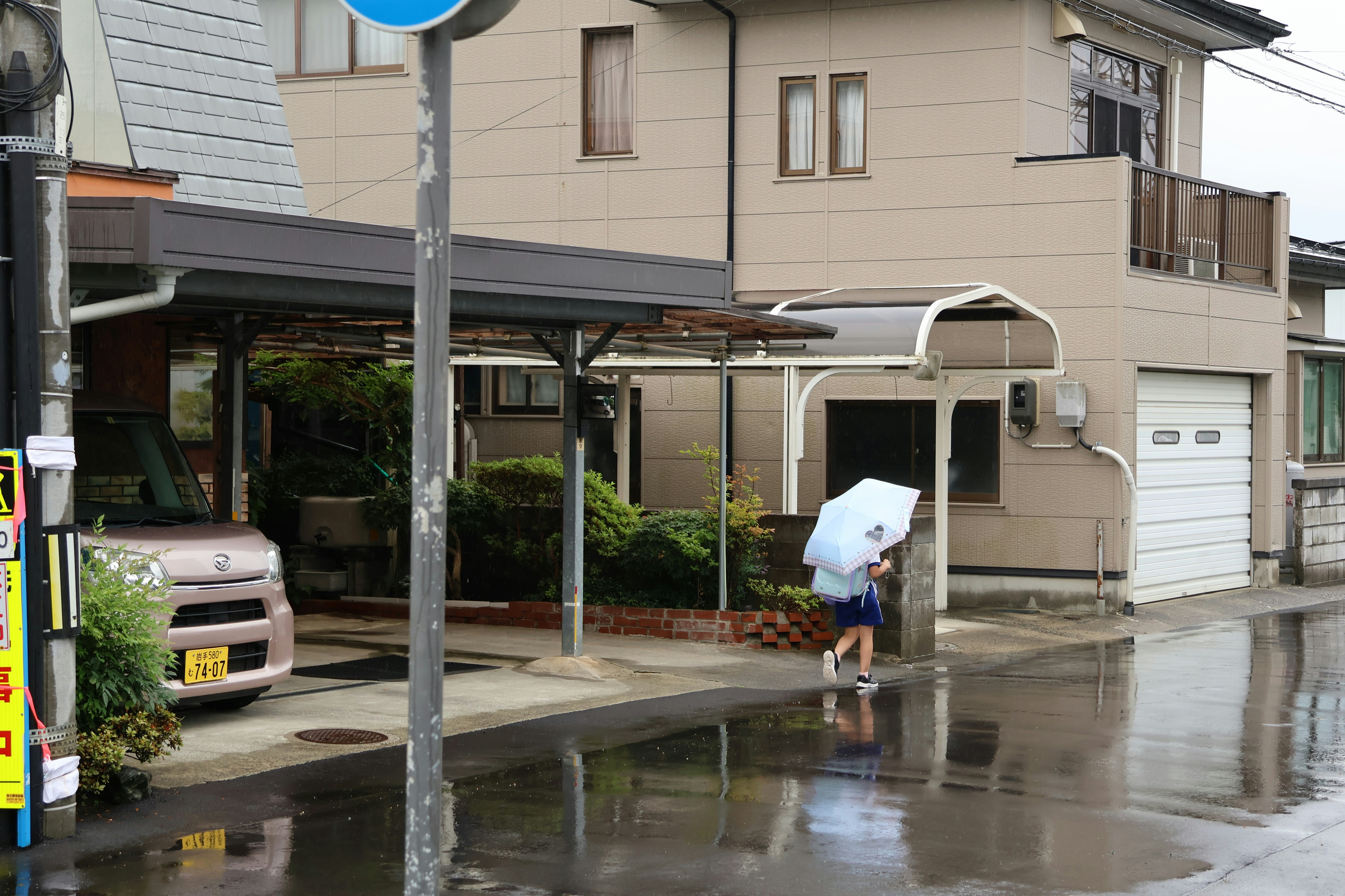 Rain-Slick Street: Umbrella in a Quiet Walk