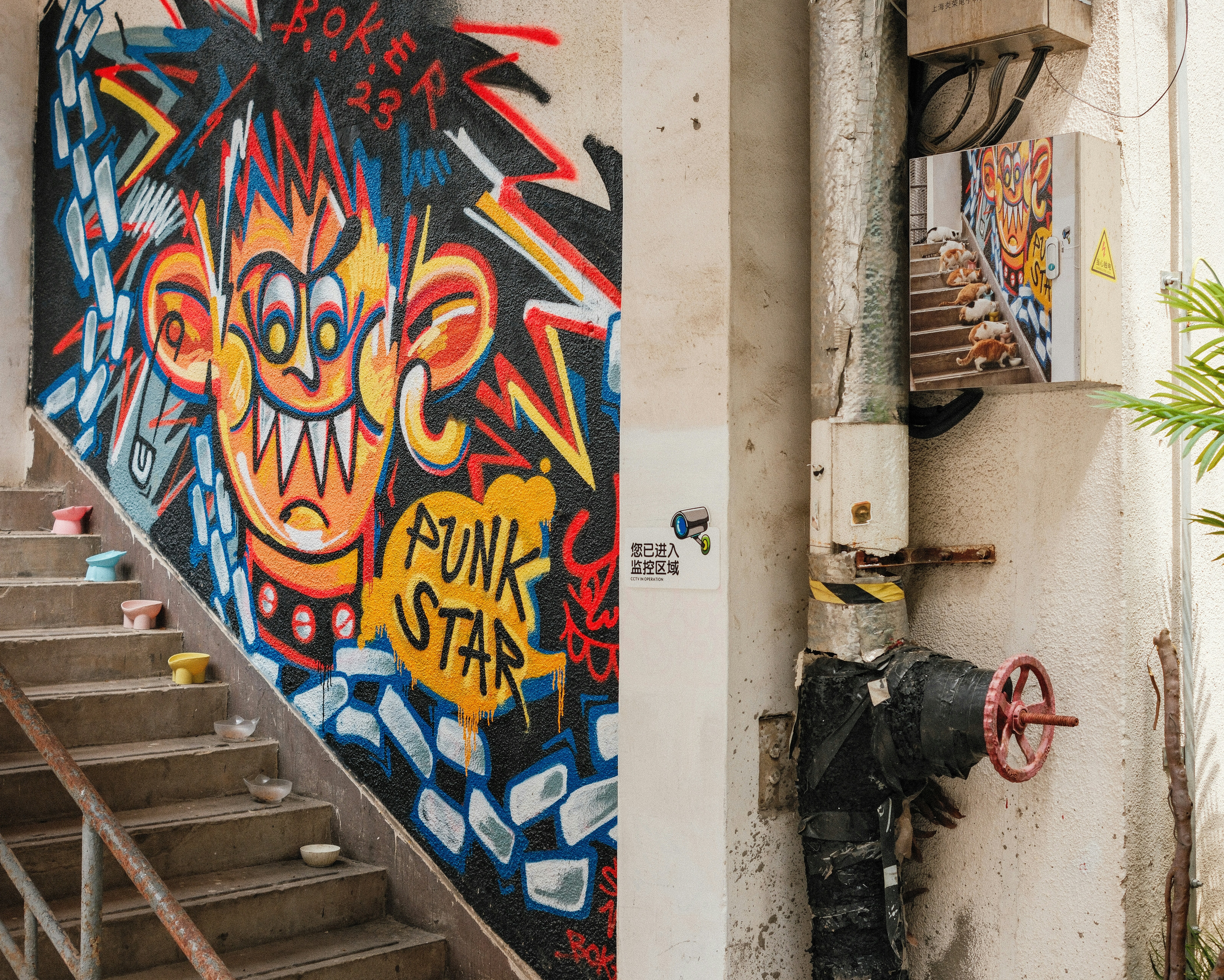 Chromatic Monkey Graffiti Beside the Stairwell