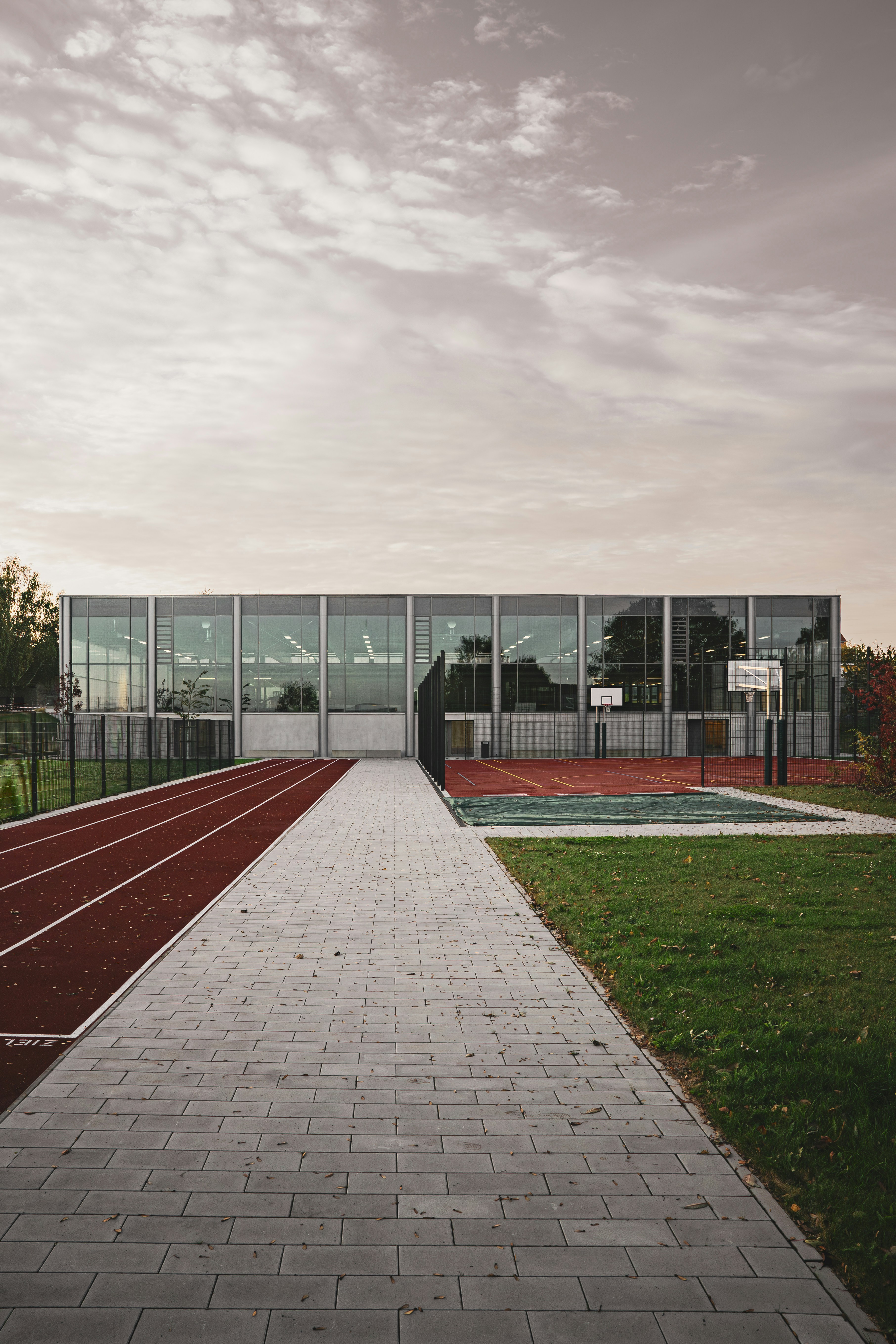 Architecture photo of gym in autumnal sunrise - by Hetterich Architekten BDA Link to the website: www.hetterich-architekten.com