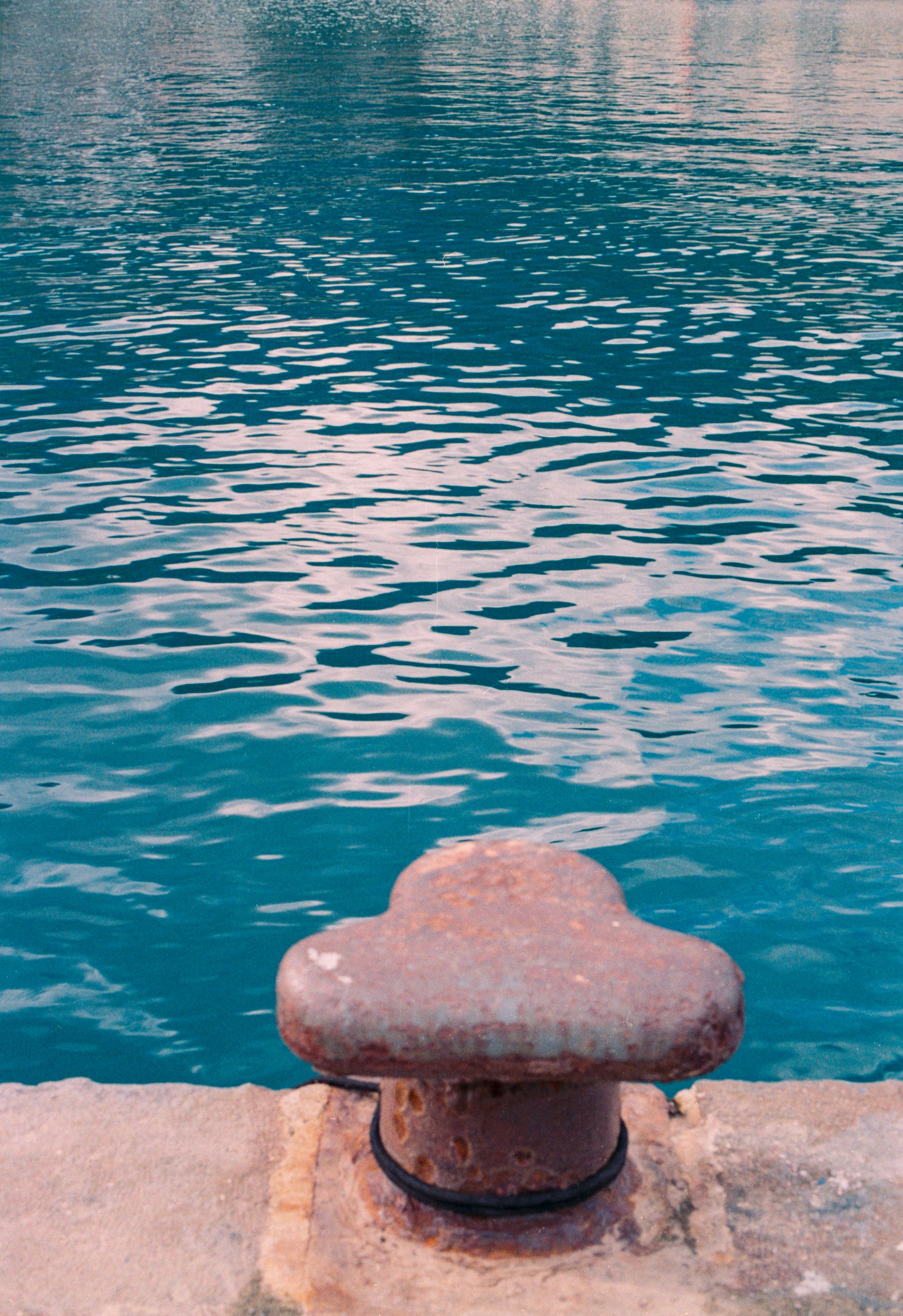 A fire hydrant sitting in the middle of a pool photo – Free Salerno ...