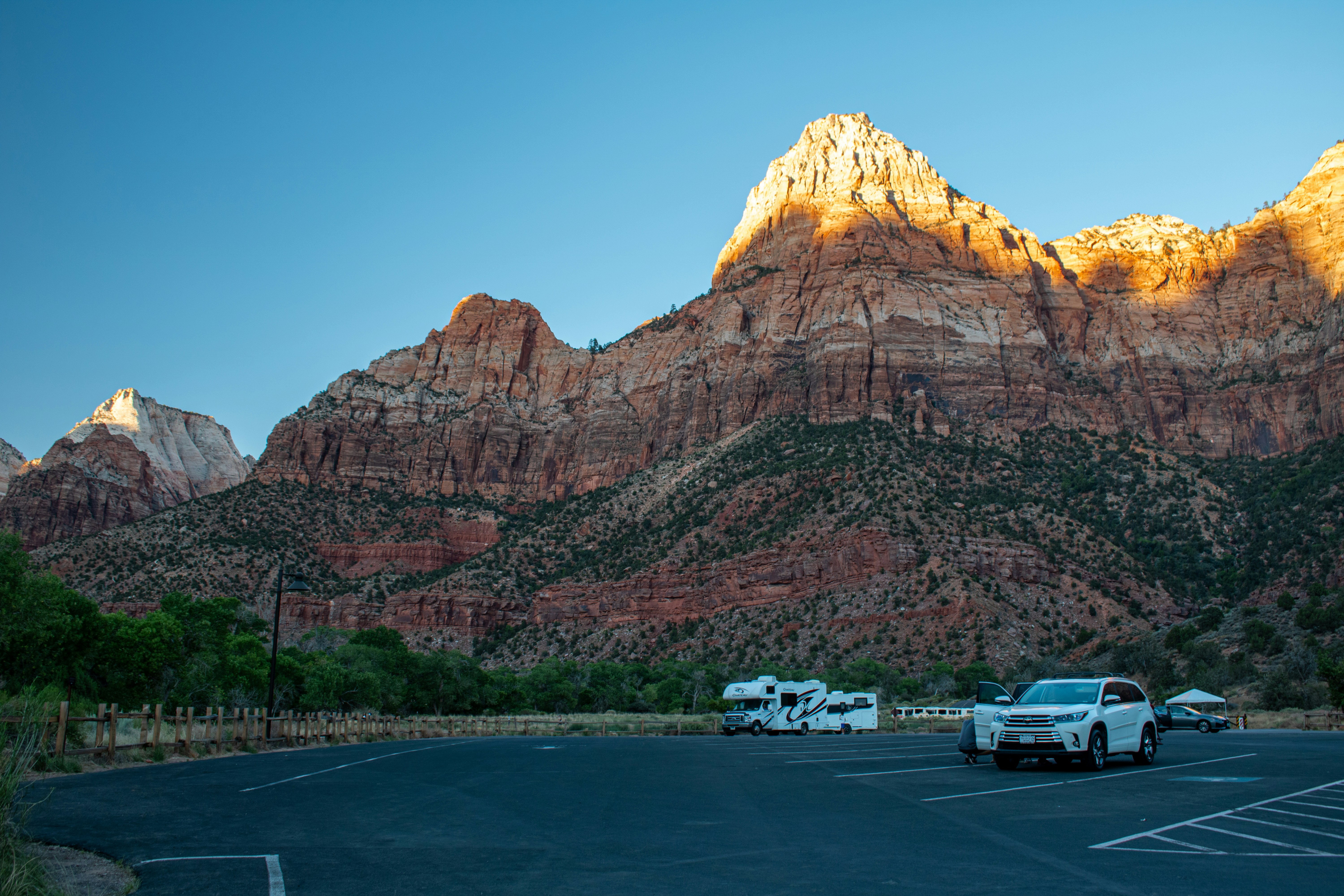 Golden Crest Over Red Rock Canyon: Quiet Parking Lot by a Desert Vista