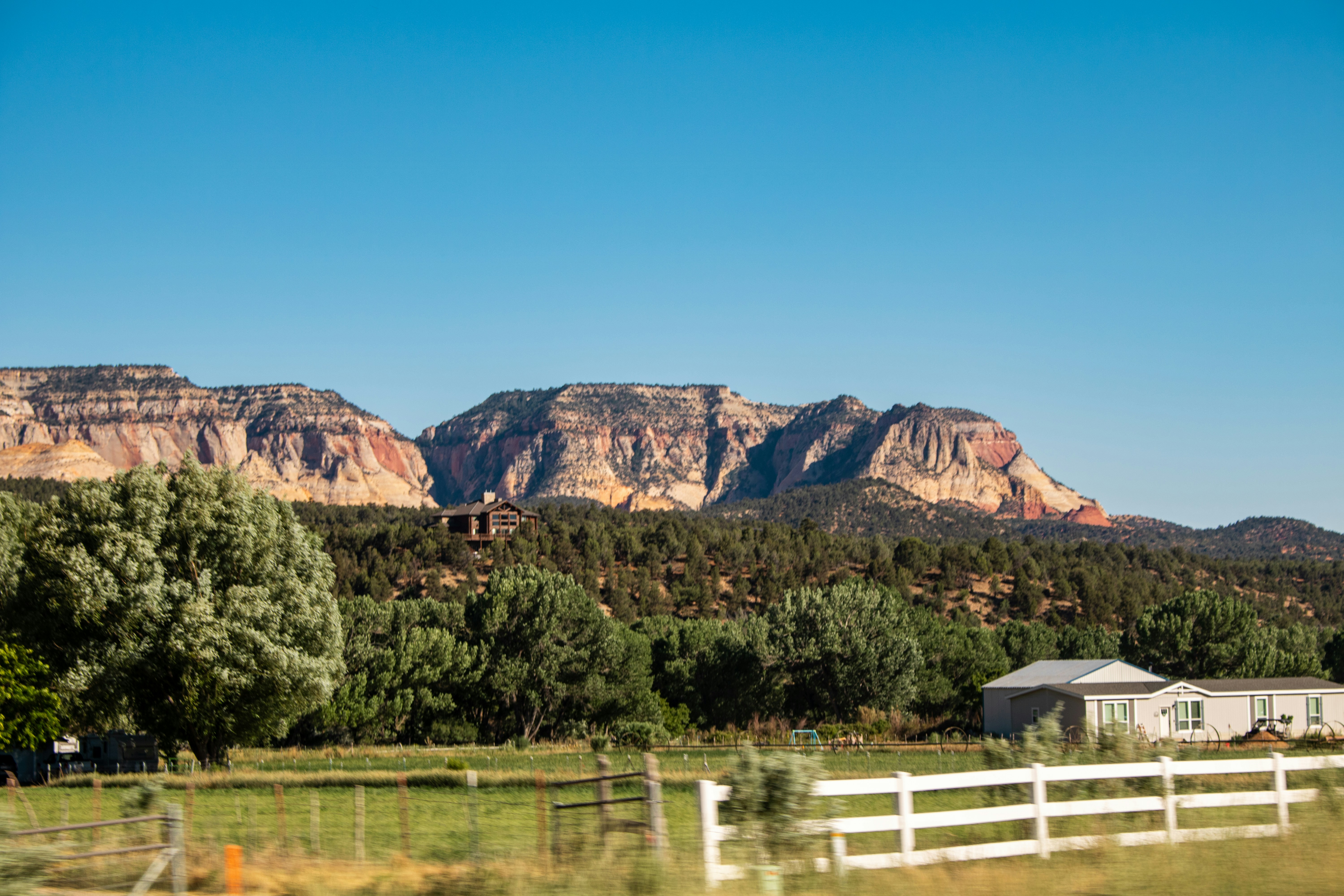 A farm with mountains in the background photo – Free Orderville Image ...