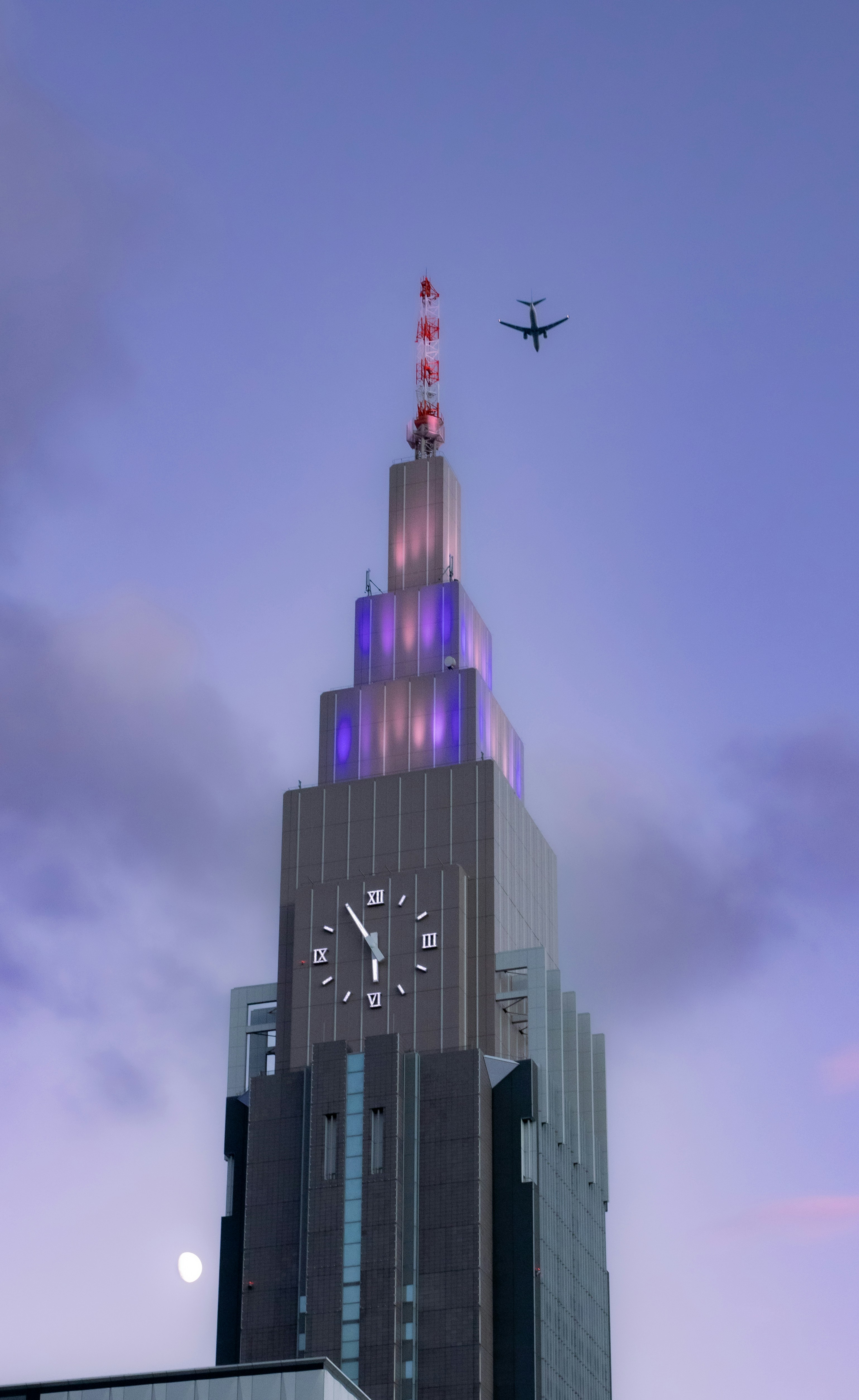 Purple Spire: Twilight Clocktower and a Jet Silhouette