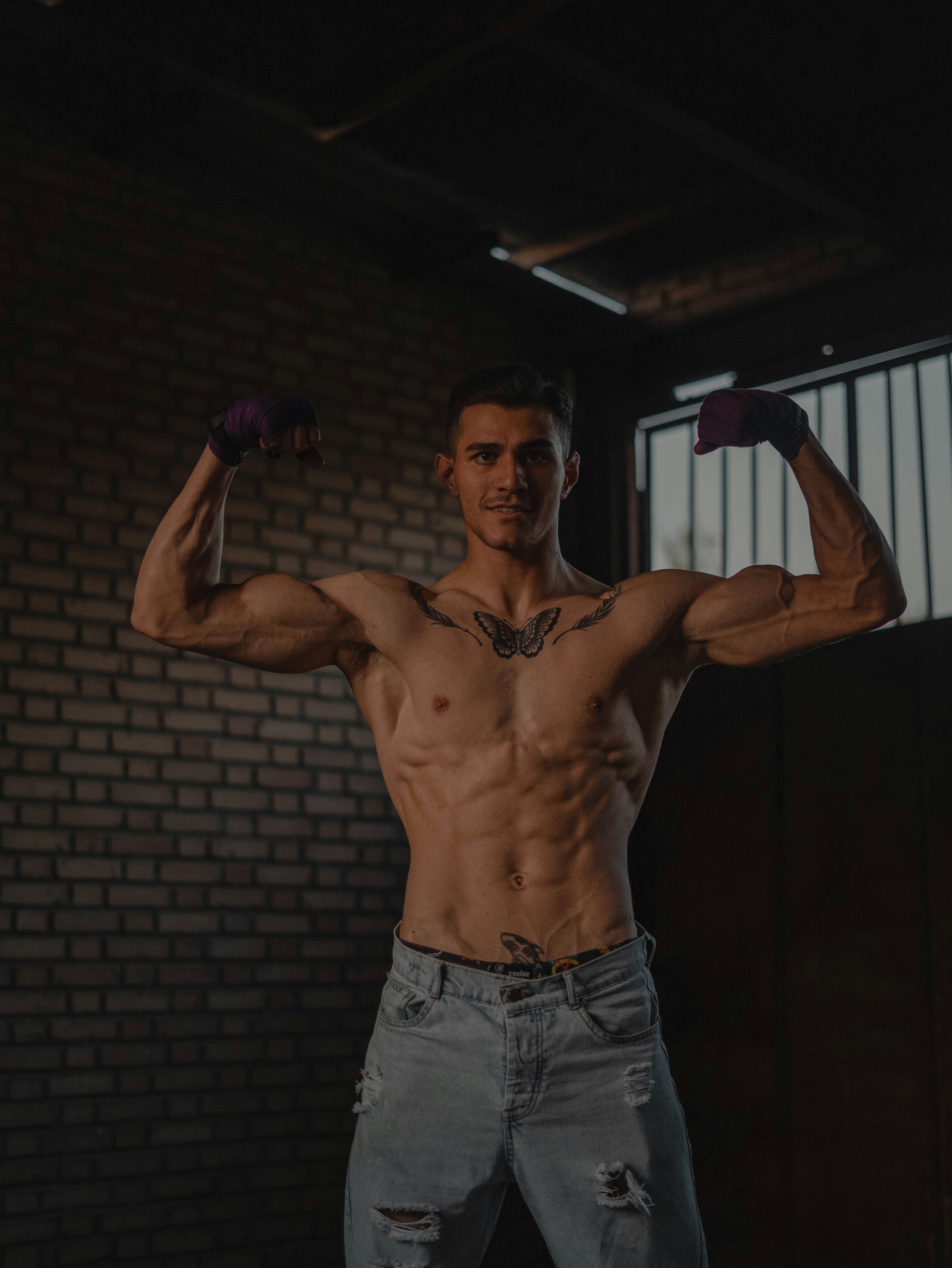 Brick-Wired Strength: A Focused Portrait in Industrial Light