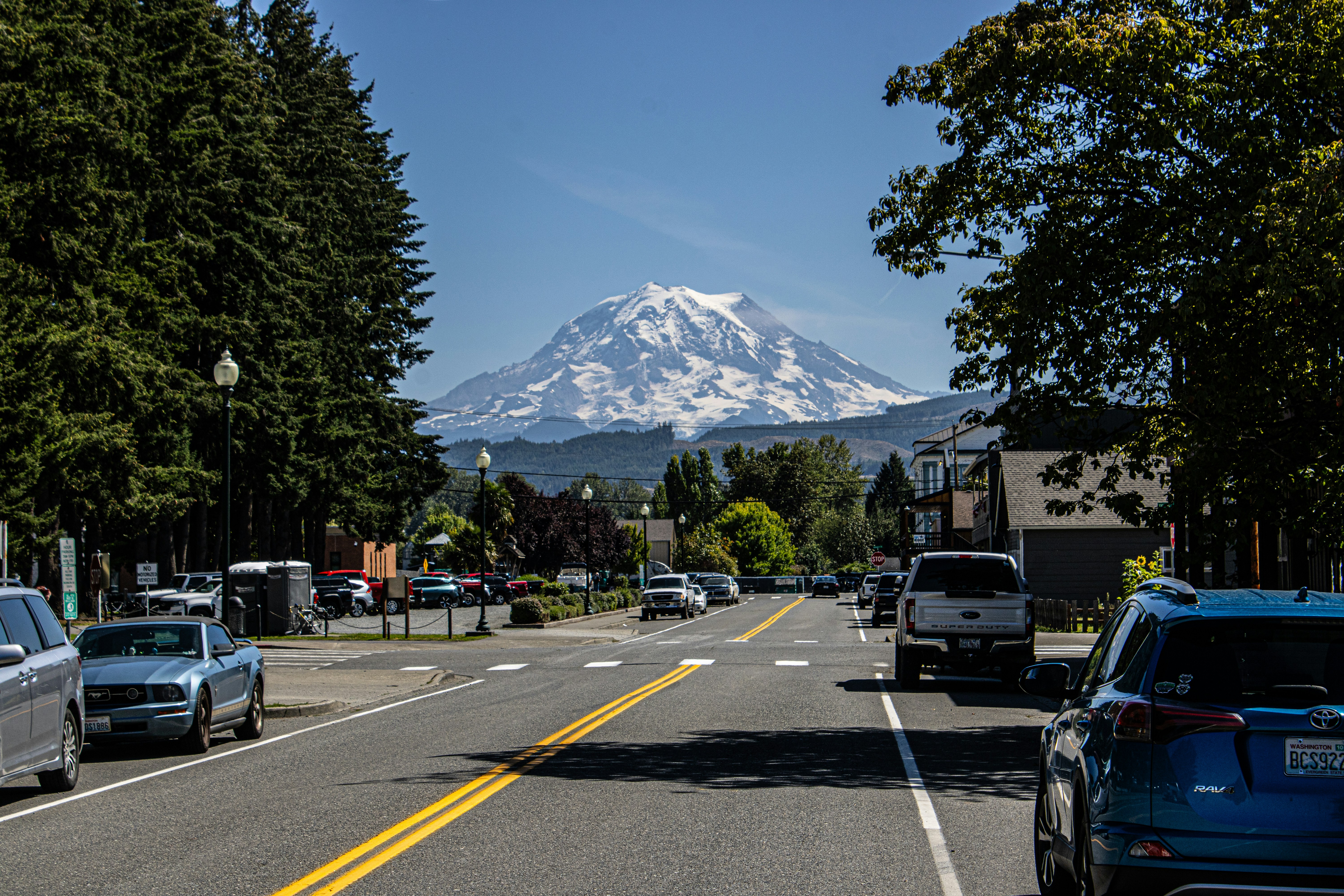 Snow-Capped Peak Framing a Sunlit Main Street