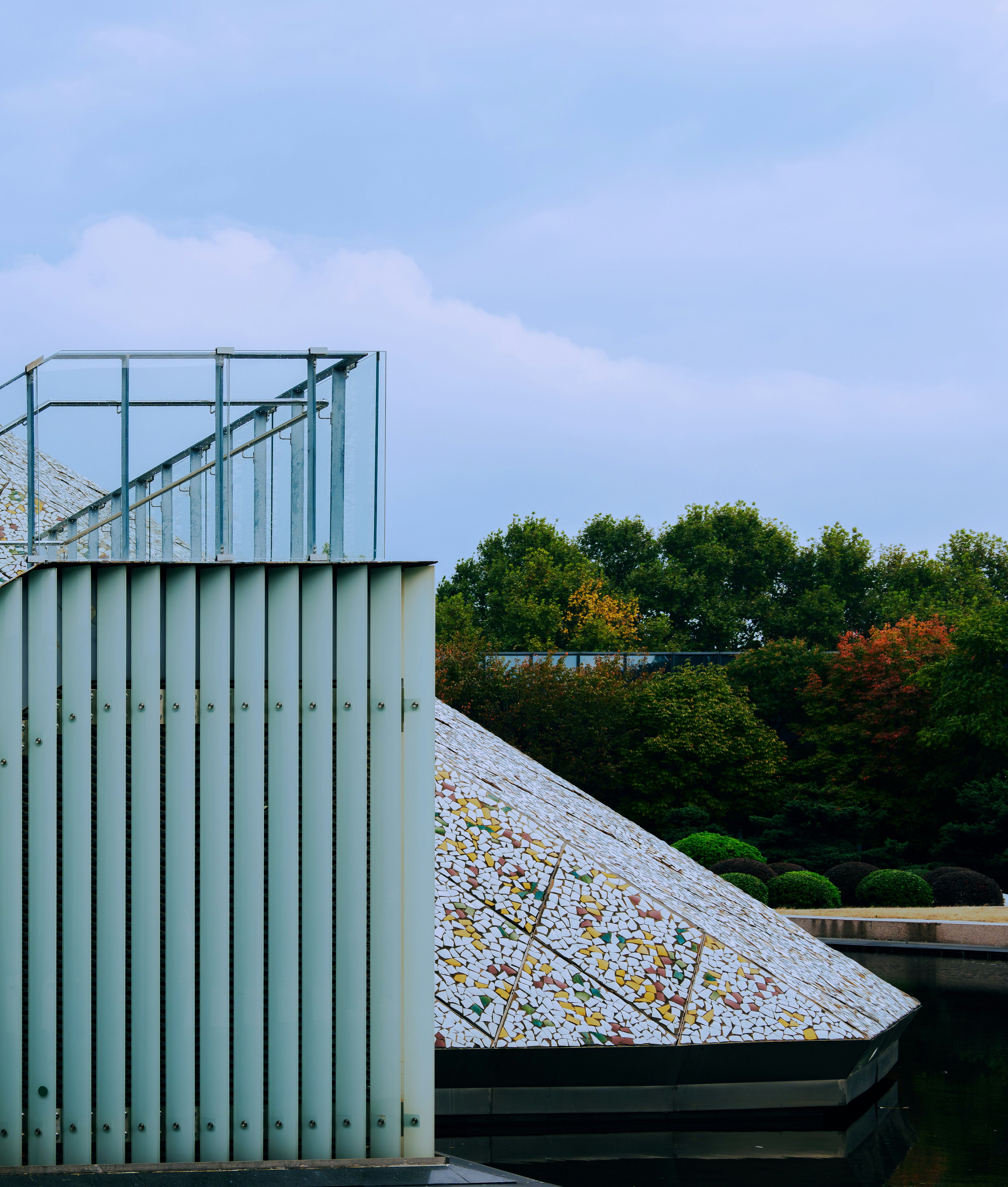 Vertical Fins and Mosaic Roof: Geometry at the Edge of a Quiet Garden