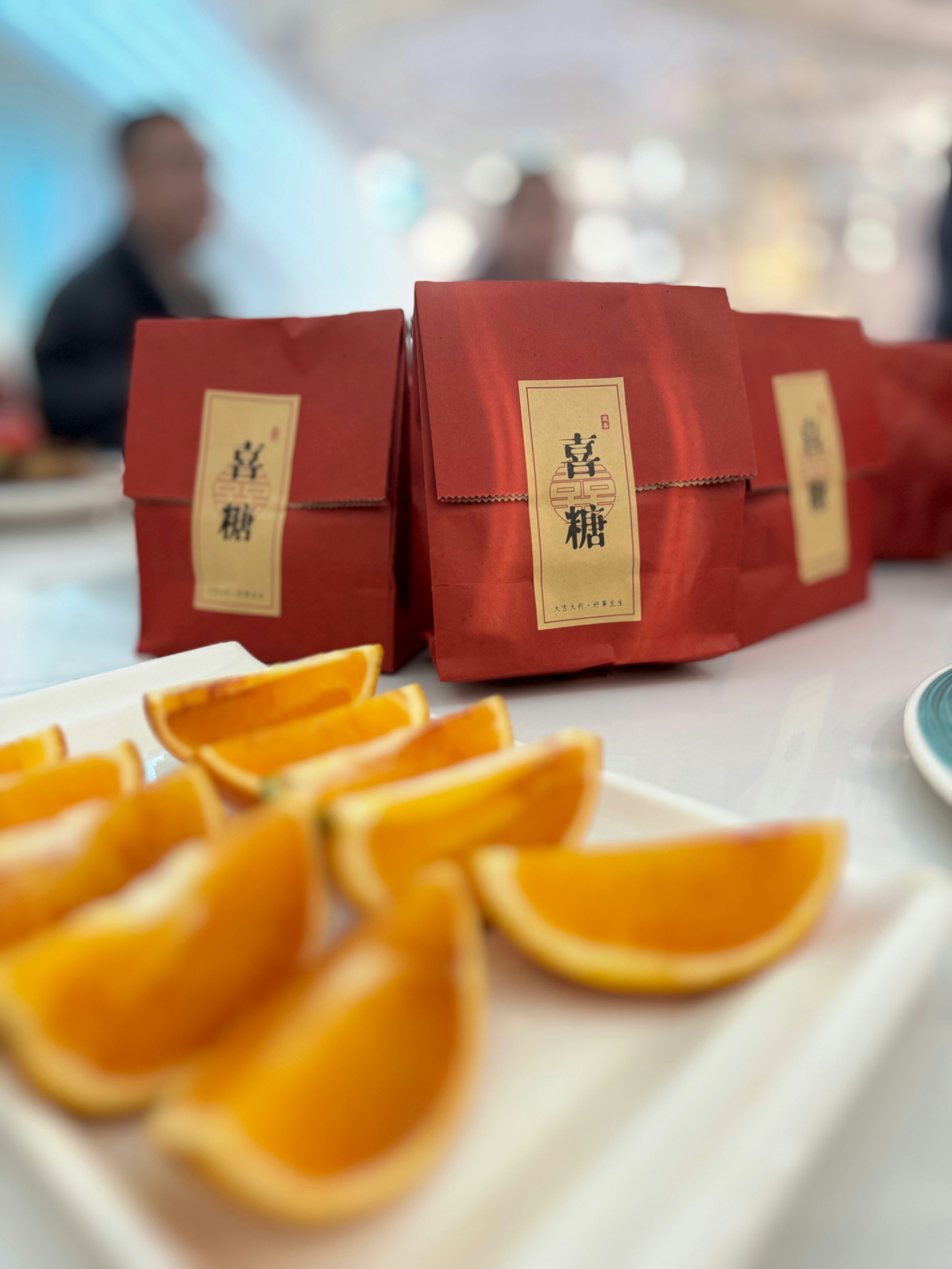 Juice and Velvet Red: Orange Segments Framed by Gift Packages