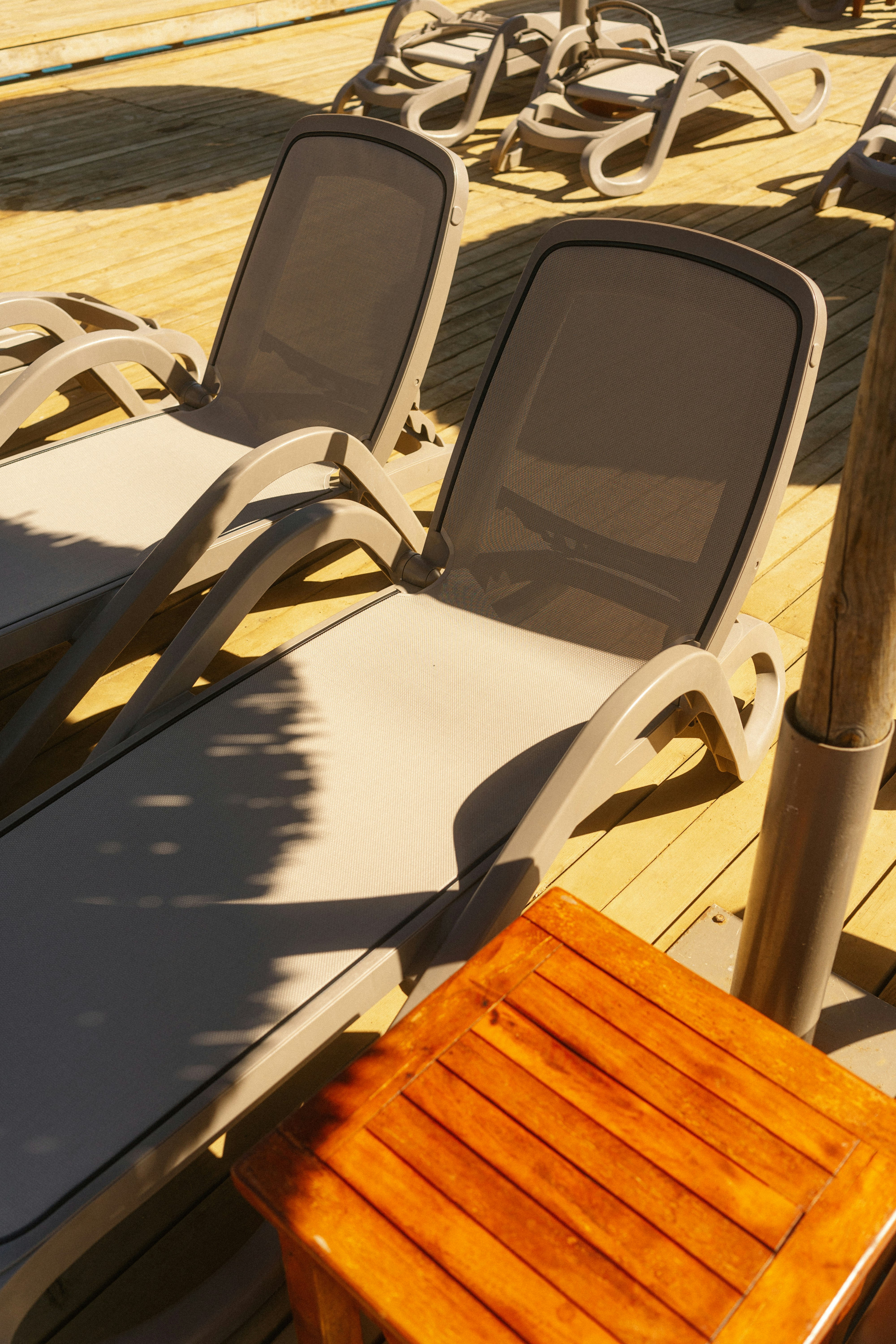 Sunlit Deck Chairs: Quiet Geometry in Warm Light