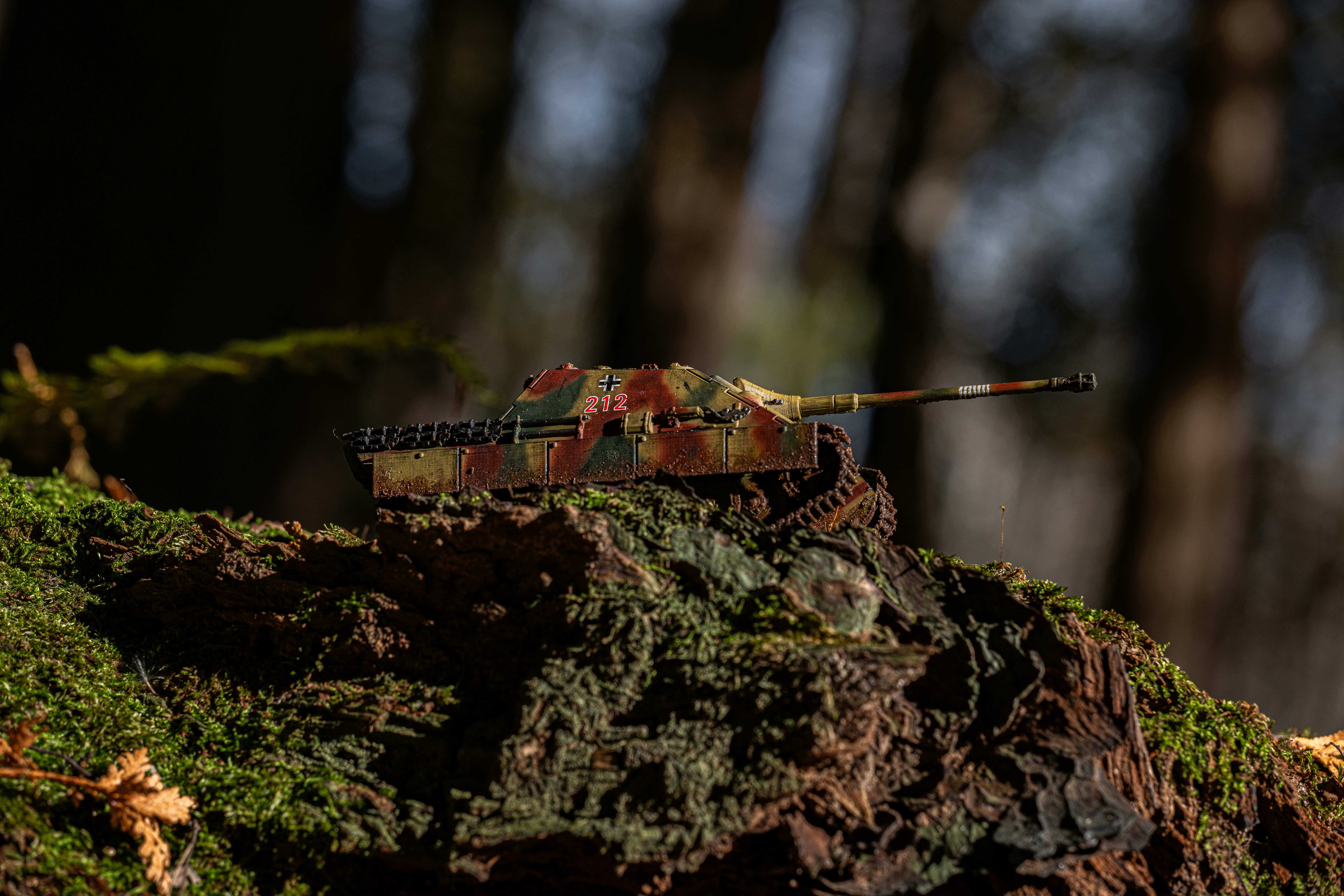 Camouflaged Siege Tank on a Mossy Stump: A Quiet Forest Diorama