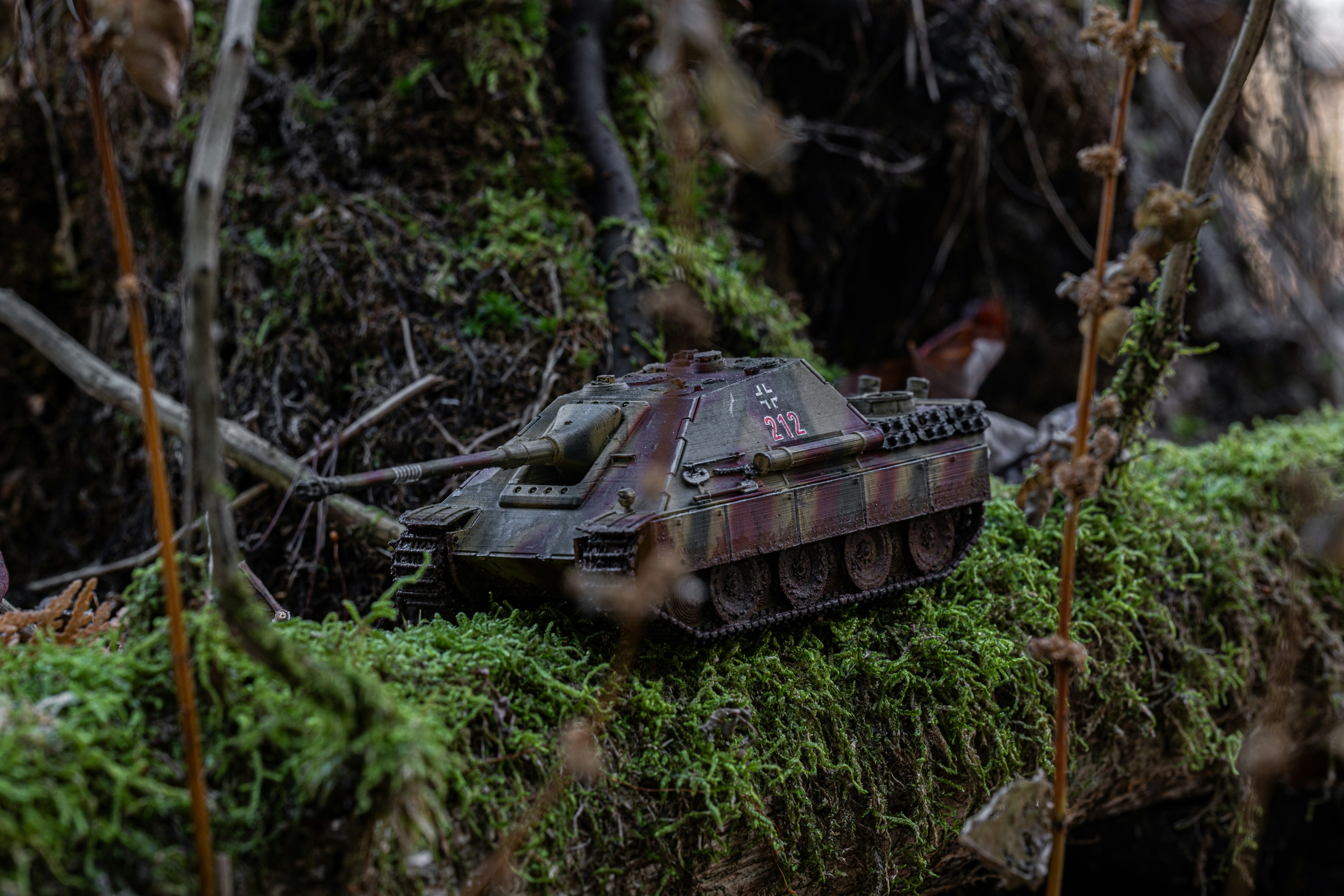 Miniature Challenger: A Rusted Tank Quietly Guarding Mossy Jungle Terrain