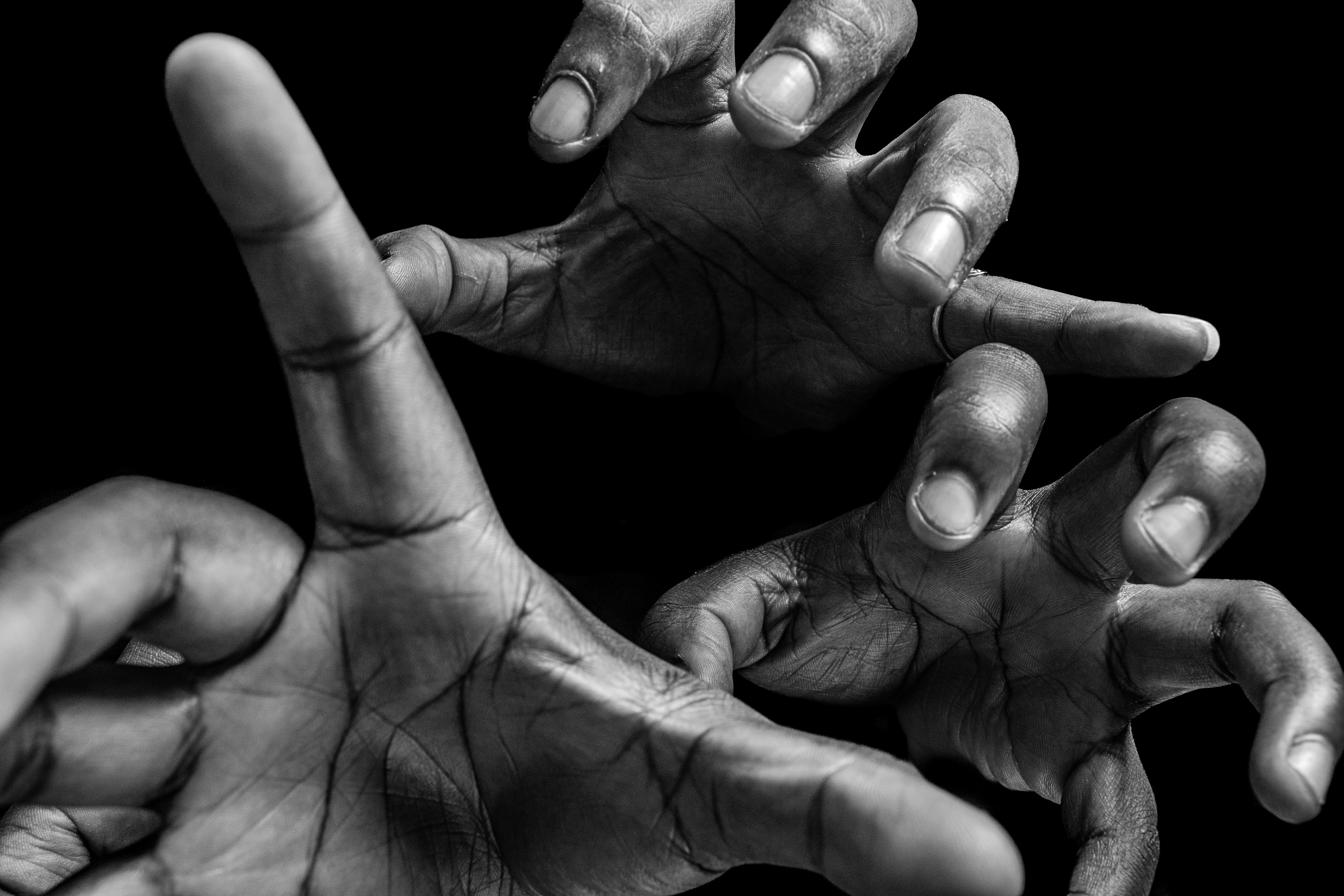 A black and white photo of two hands making the v sign photo – Free ...