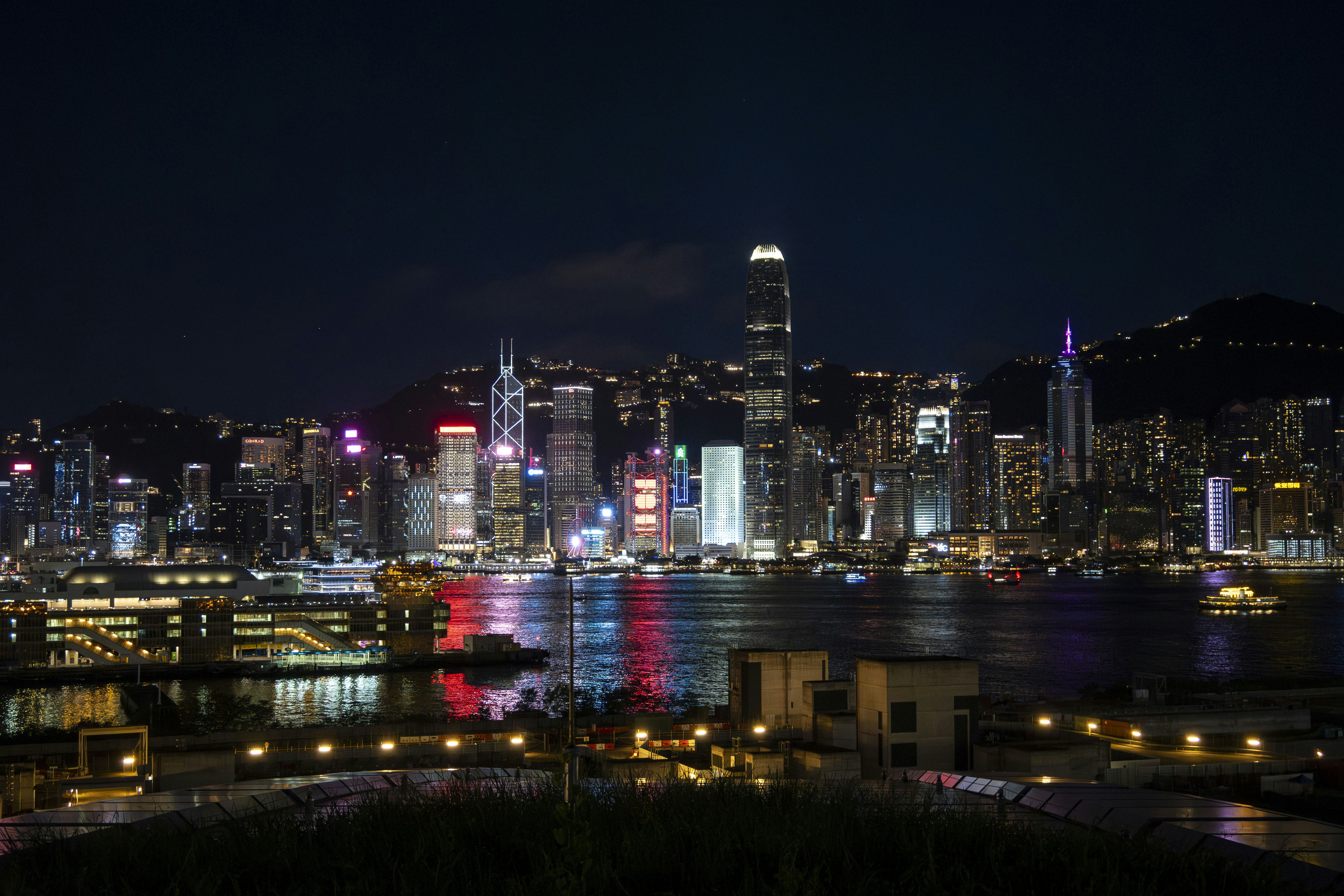 Midnight Neon over Victoria Harbour: Kowloon’s Glass Skyline in Reflection