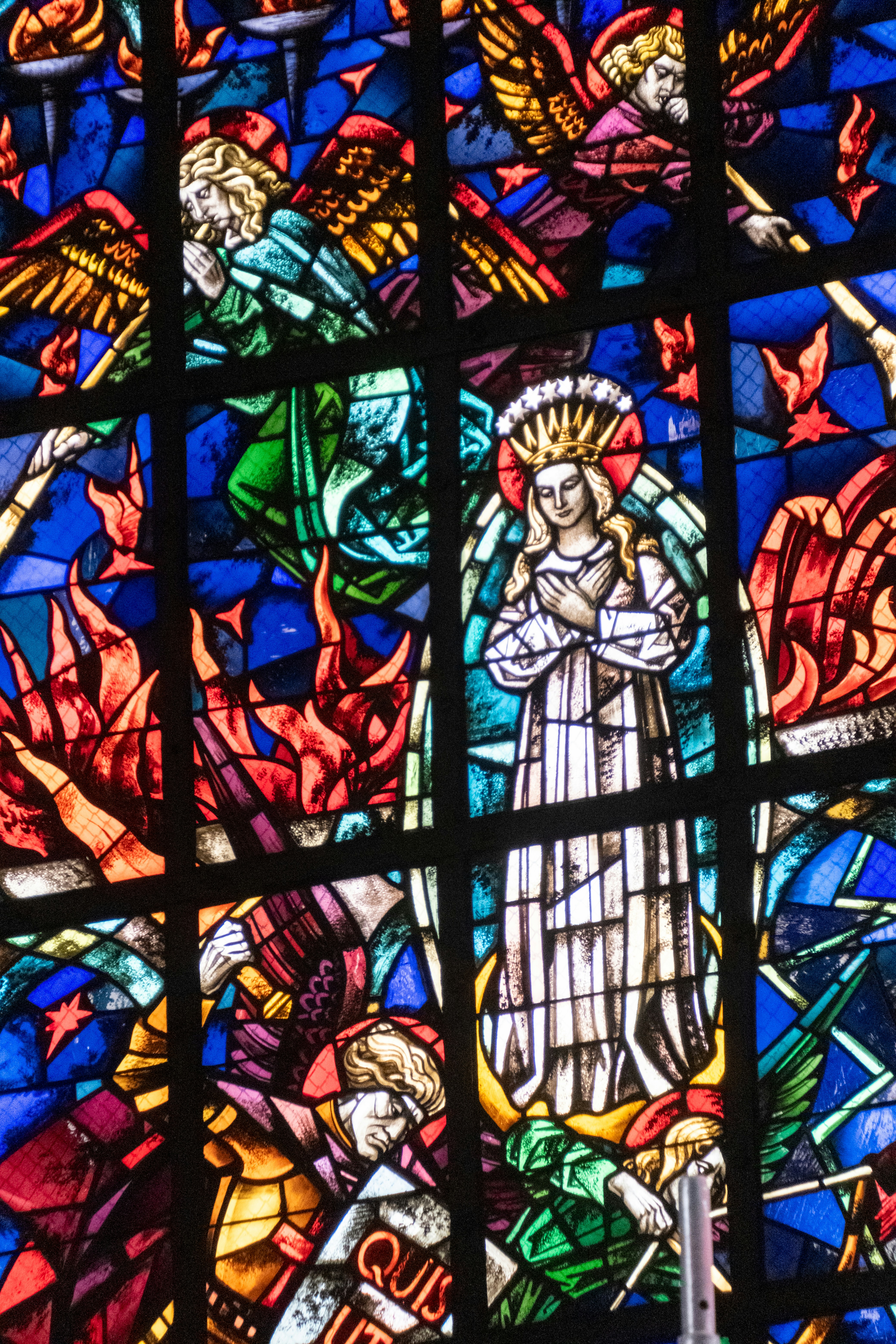 A large stained glass window with a statue in it photo – Free ...