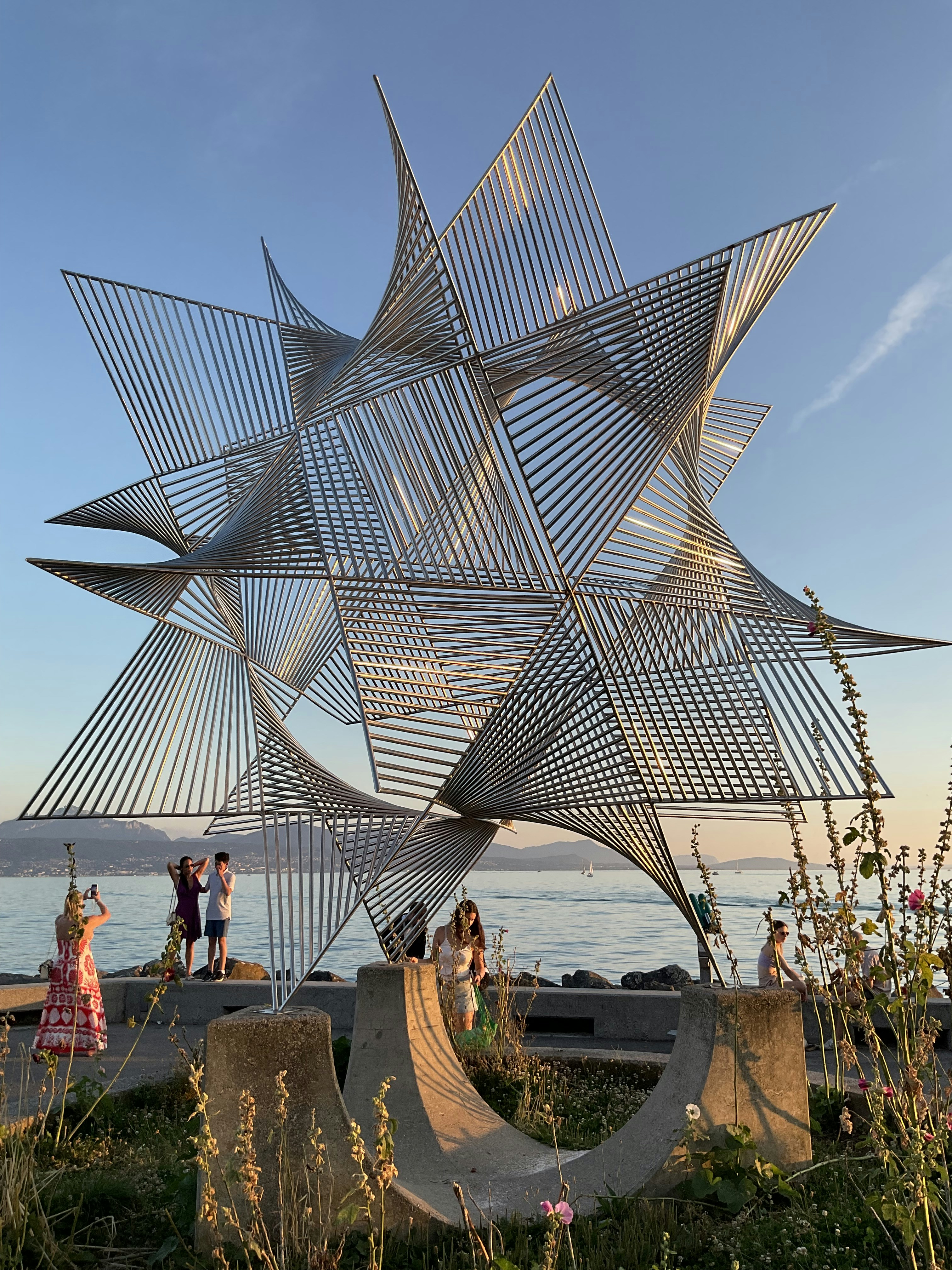 Shadows in Steel: A Geometric Seascape at Sunset