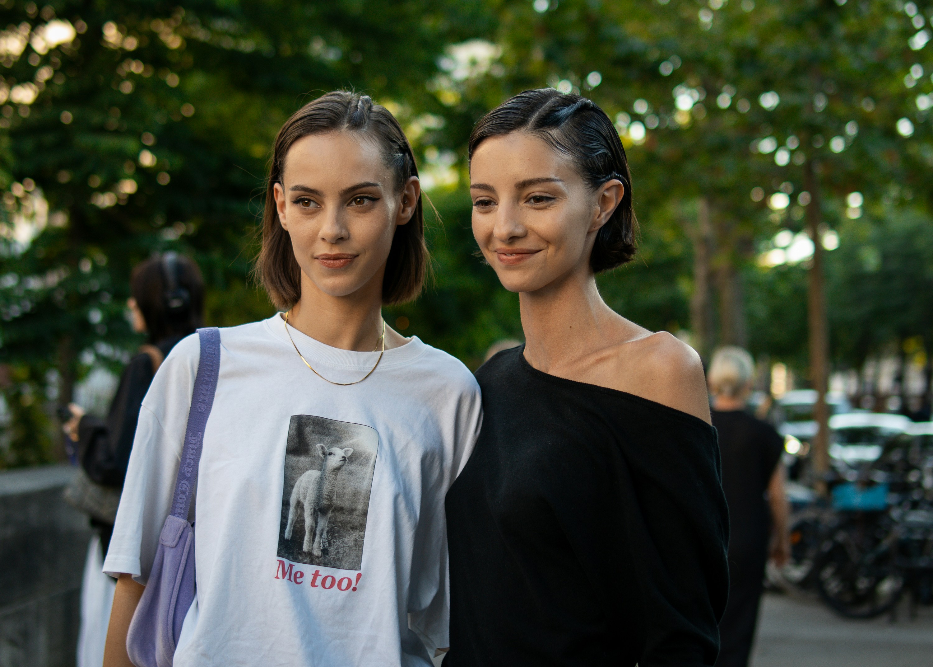 A couple of women standing next to each other photo – Free Human Image ...