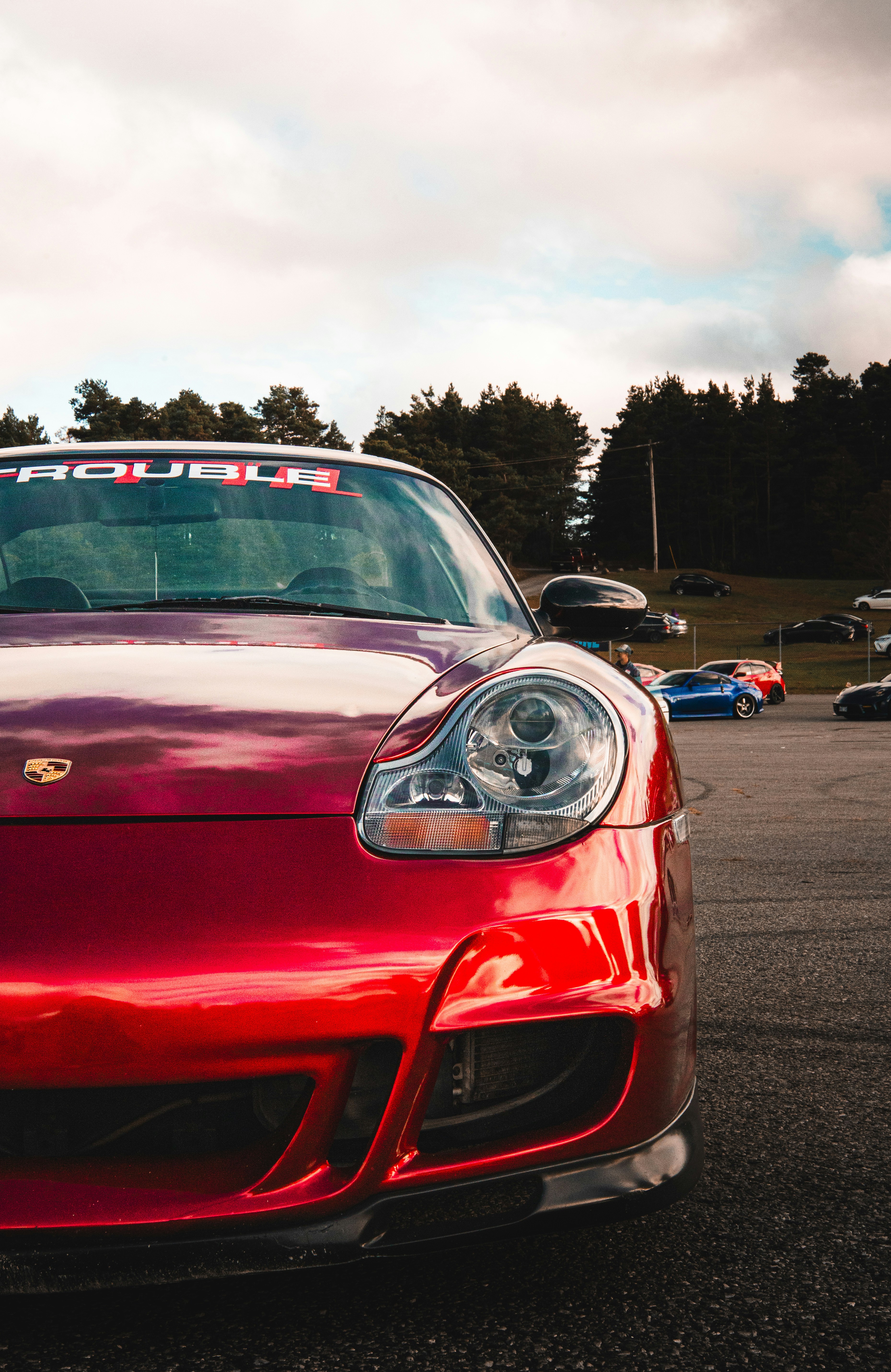 Scarlet Porsche Front Quarter: Gloss and Geometry at a Car Meet