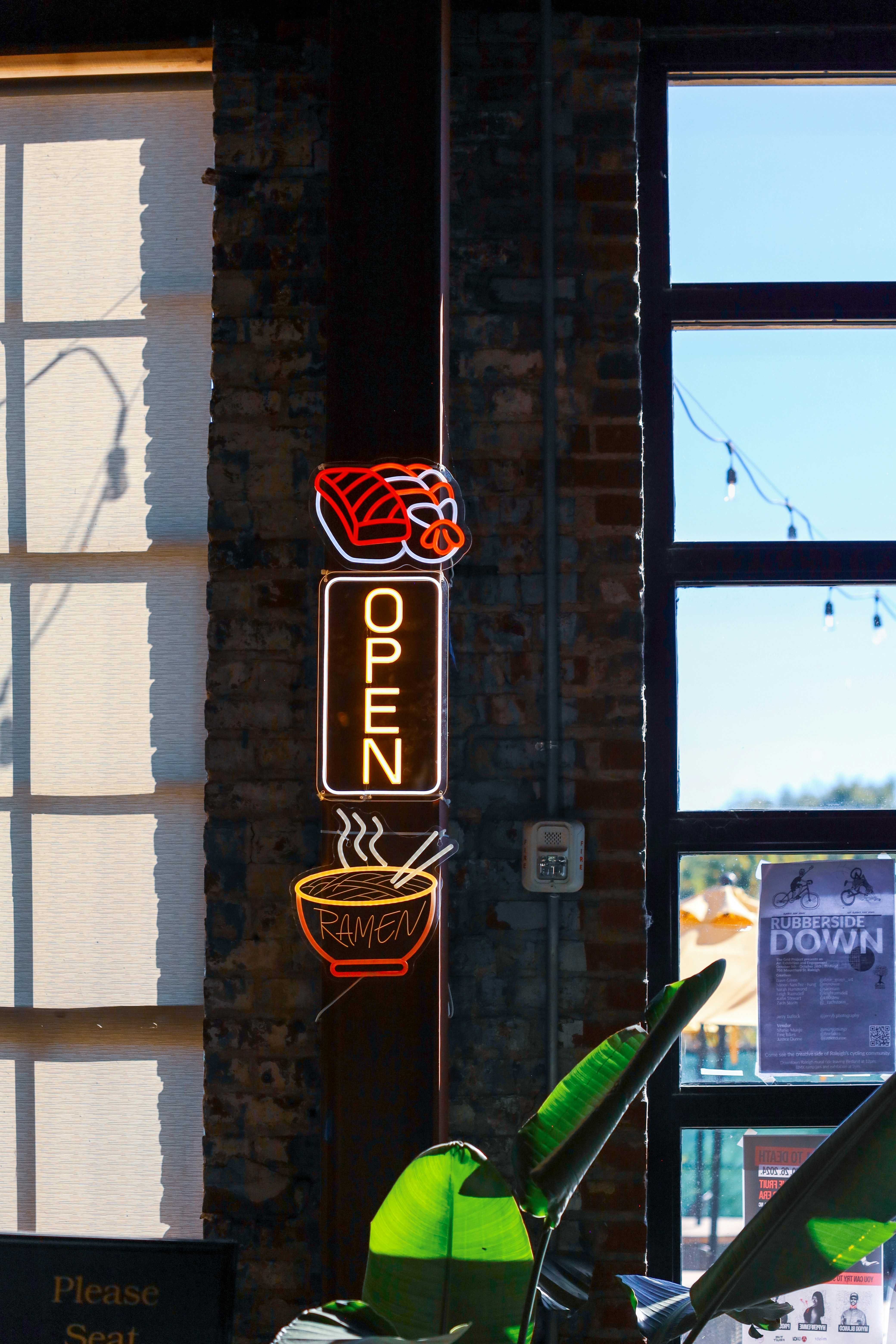 Neon Open: Ramen Glow Along Brick and Glass