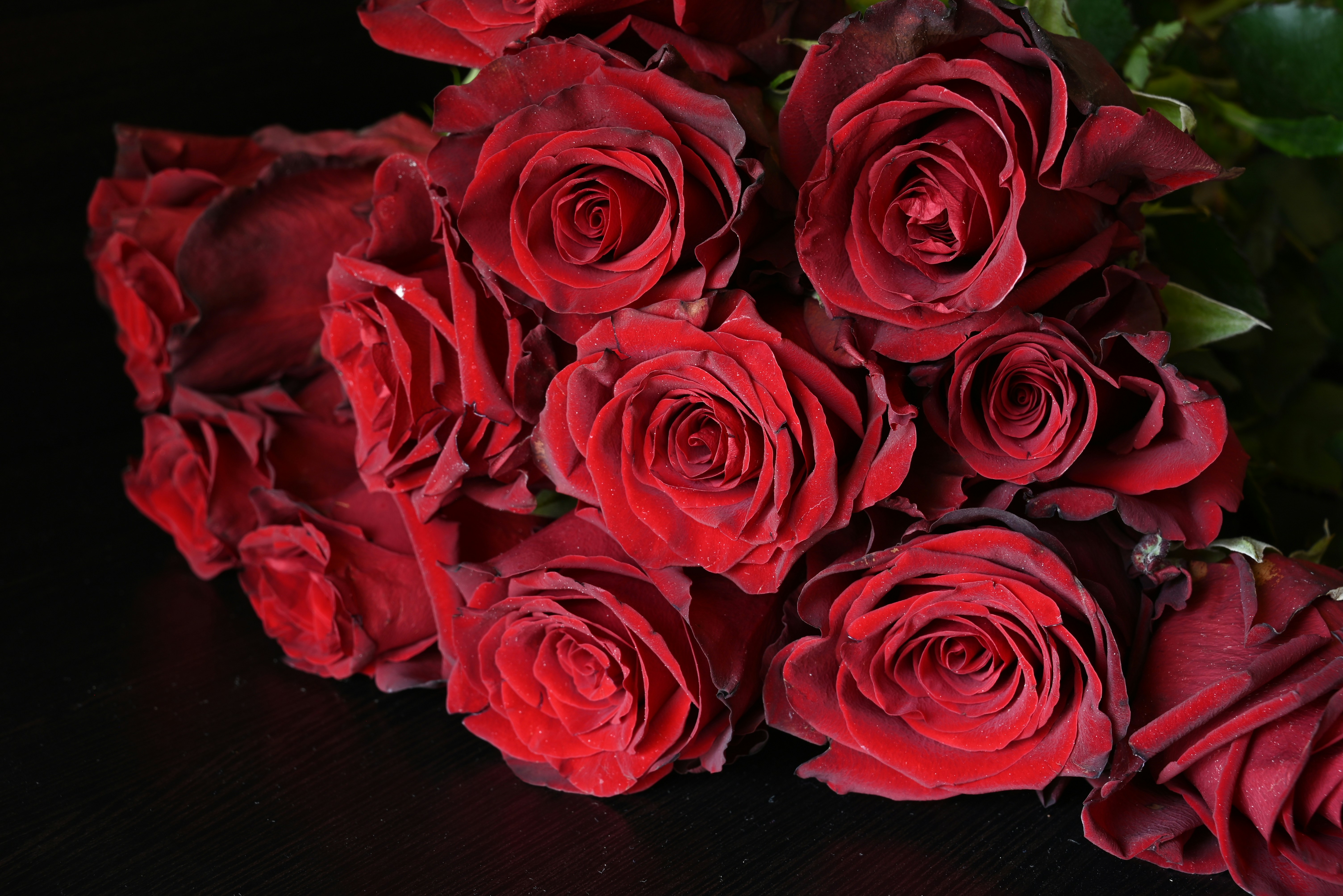 A bunch of red roses on a black surface photo – Free Happy valentines ...