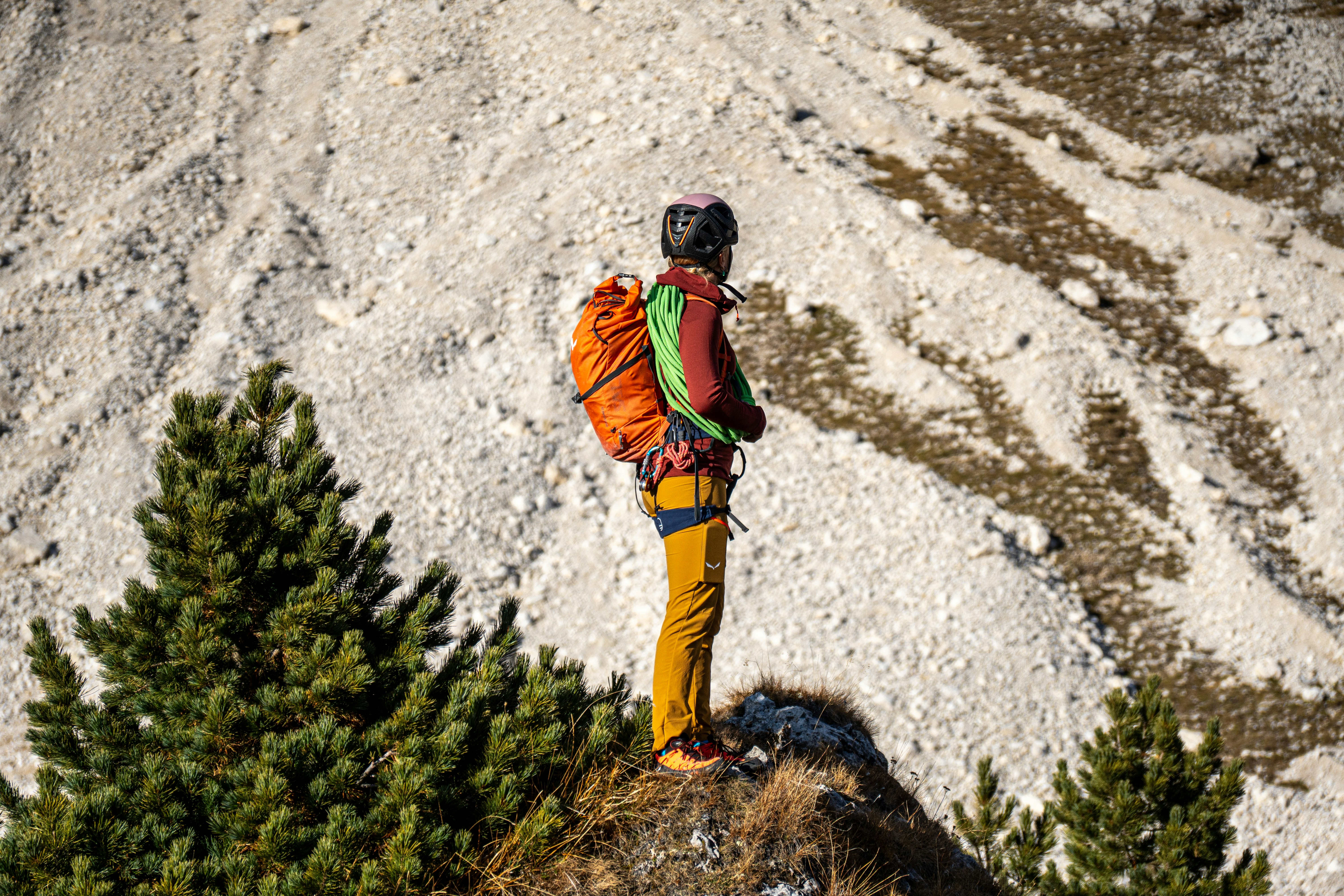 A man standing on top of a snow covered mountain