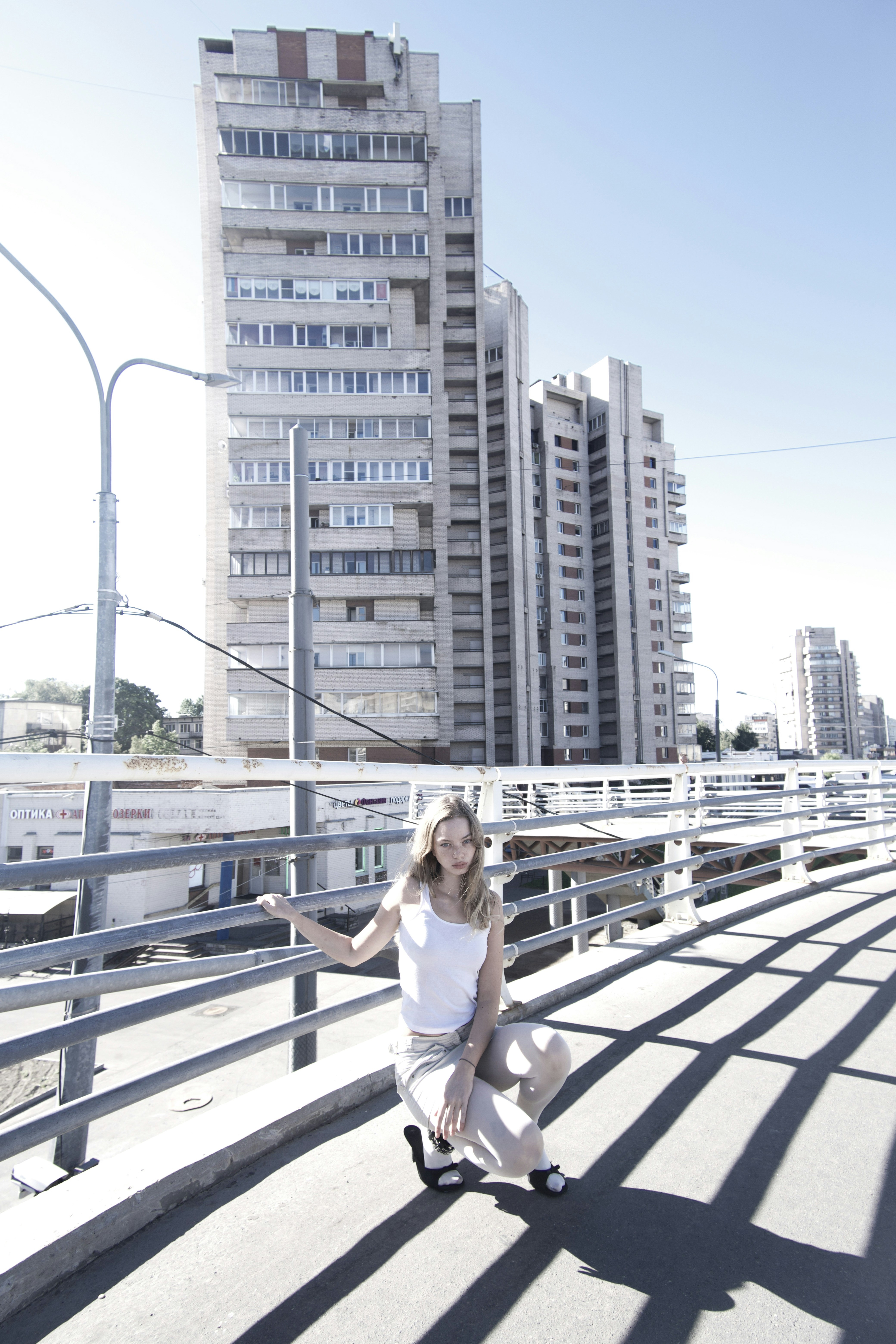 Concrete Skyline: Street-Stop Portrait on a Sunlit Overpass
