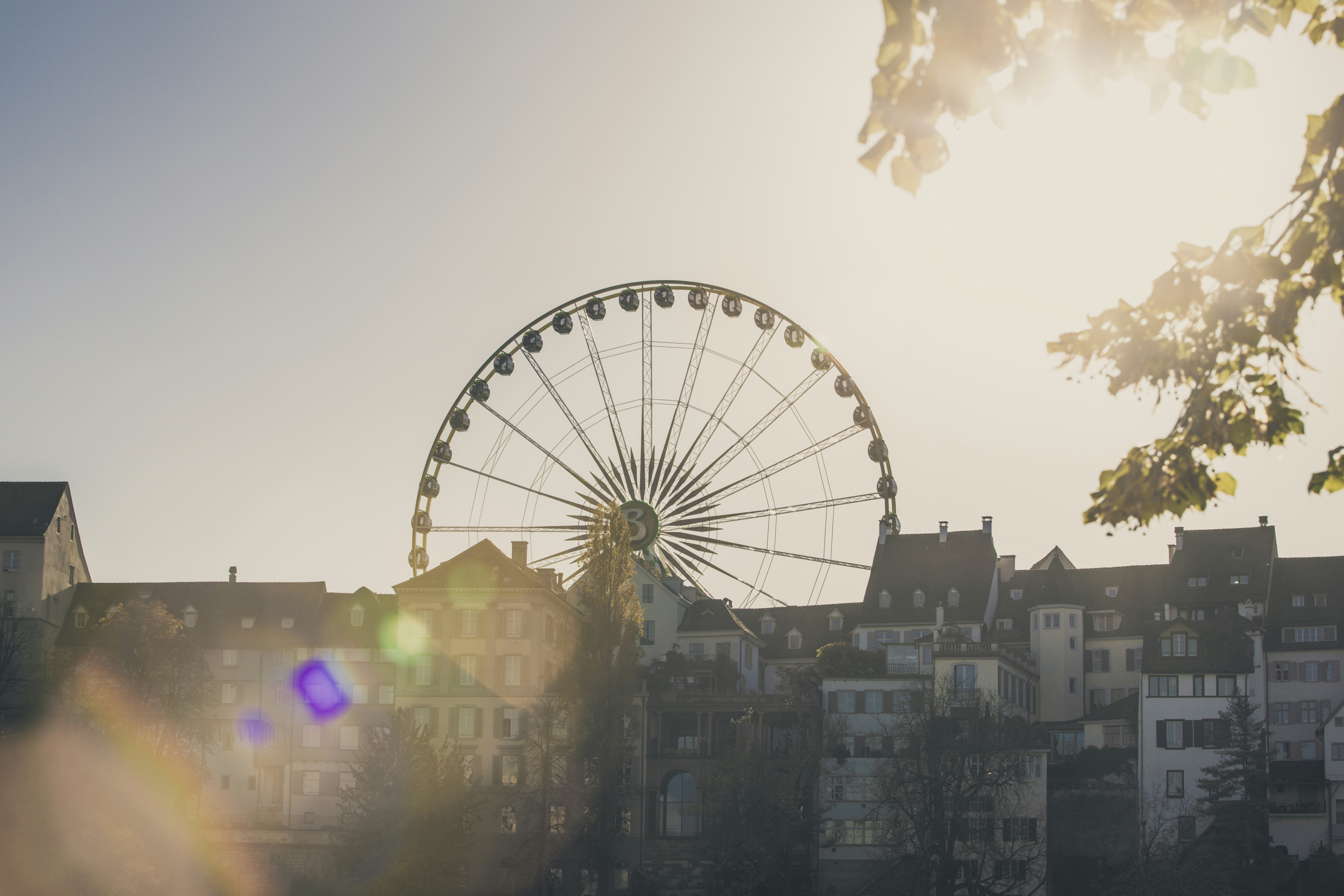 A ferris wheel in the middle of a city photo – Free Basel Image on Unsplash