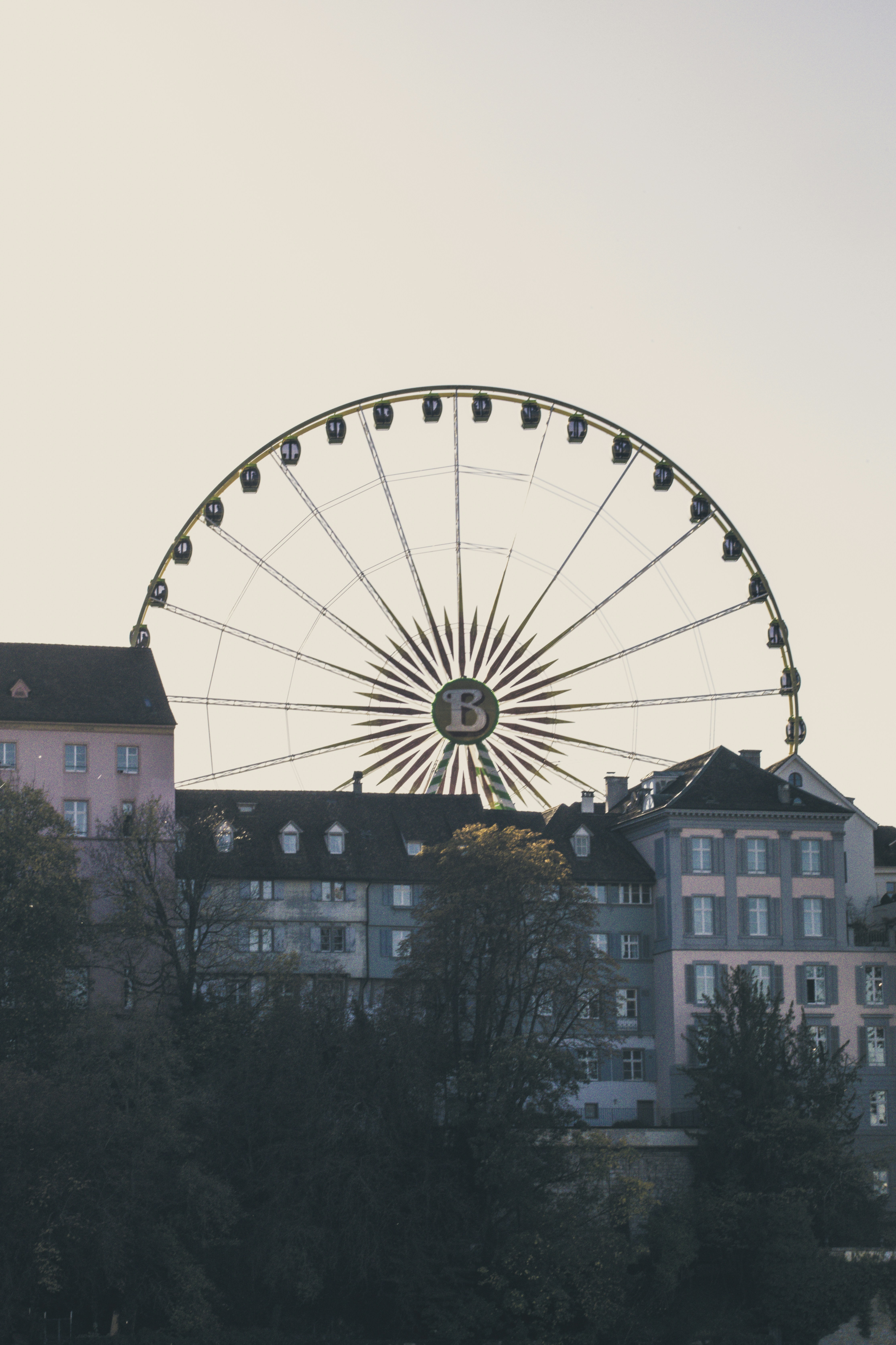 A ferris wheel in the middle of a city photo – Free Basel Image on Unsplash