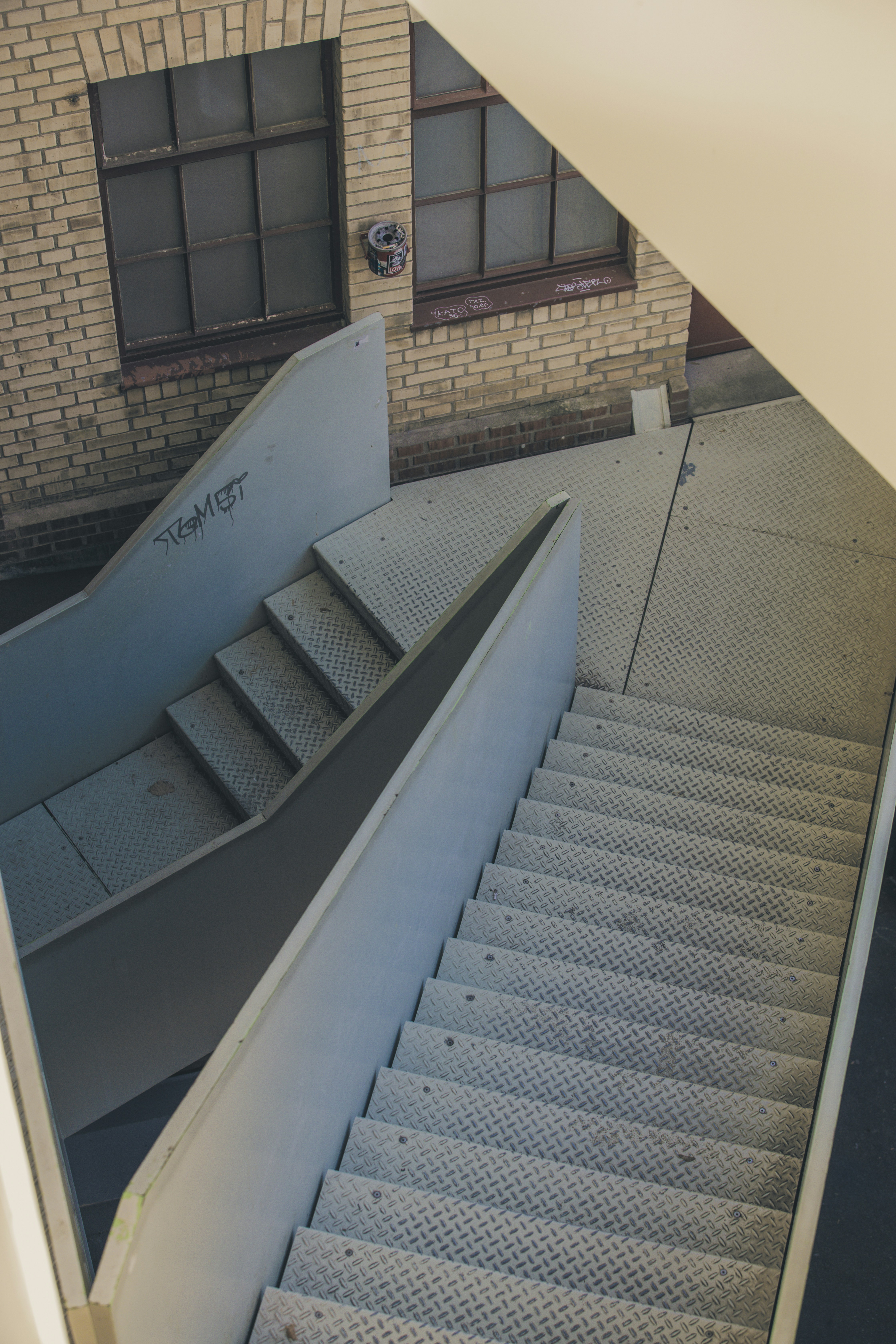 Angular Descent: Concrete Stairs Framed by Aerial Canal