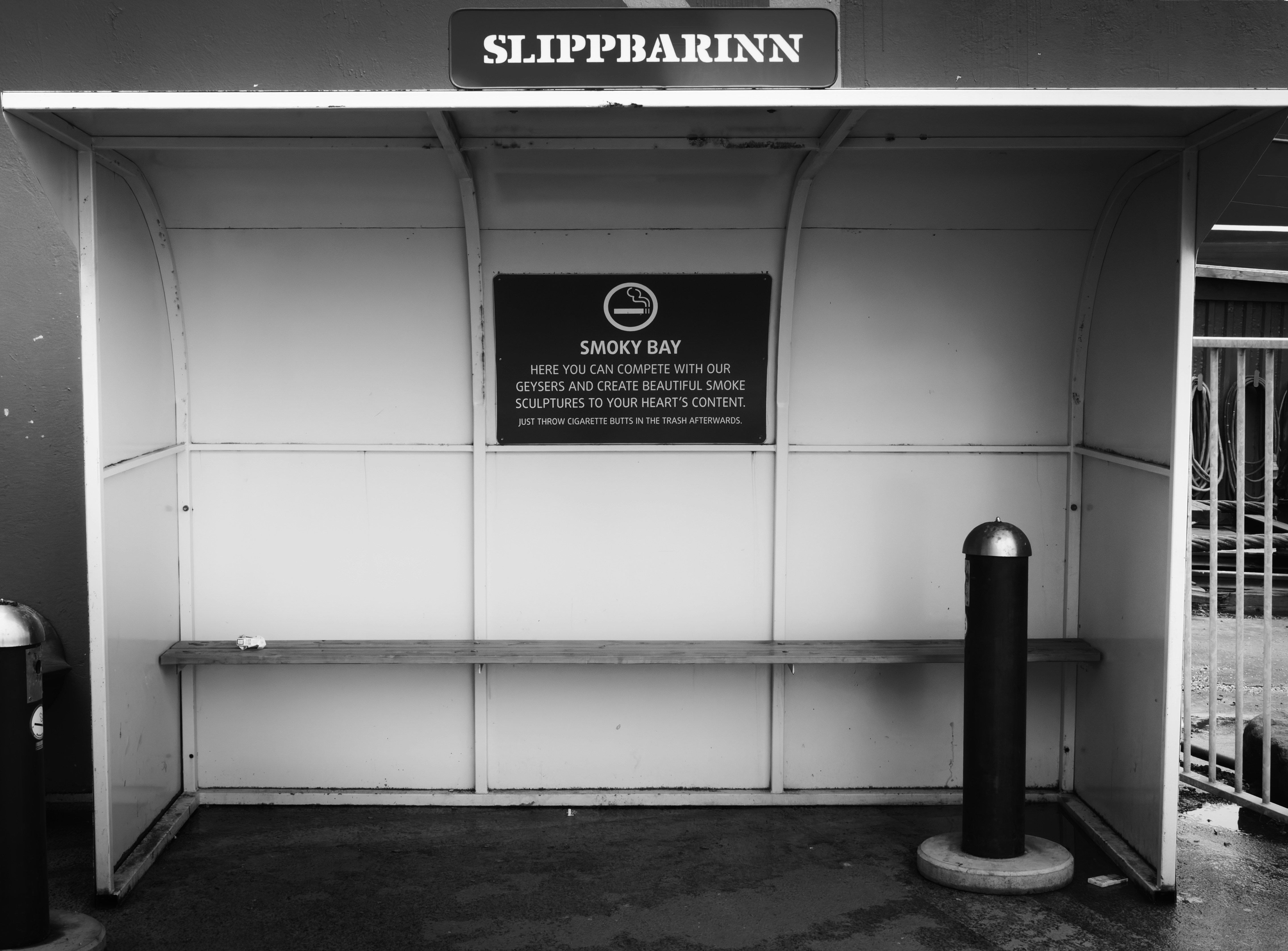 Monochrome Shelter: Central Signage in Quiet Geometry