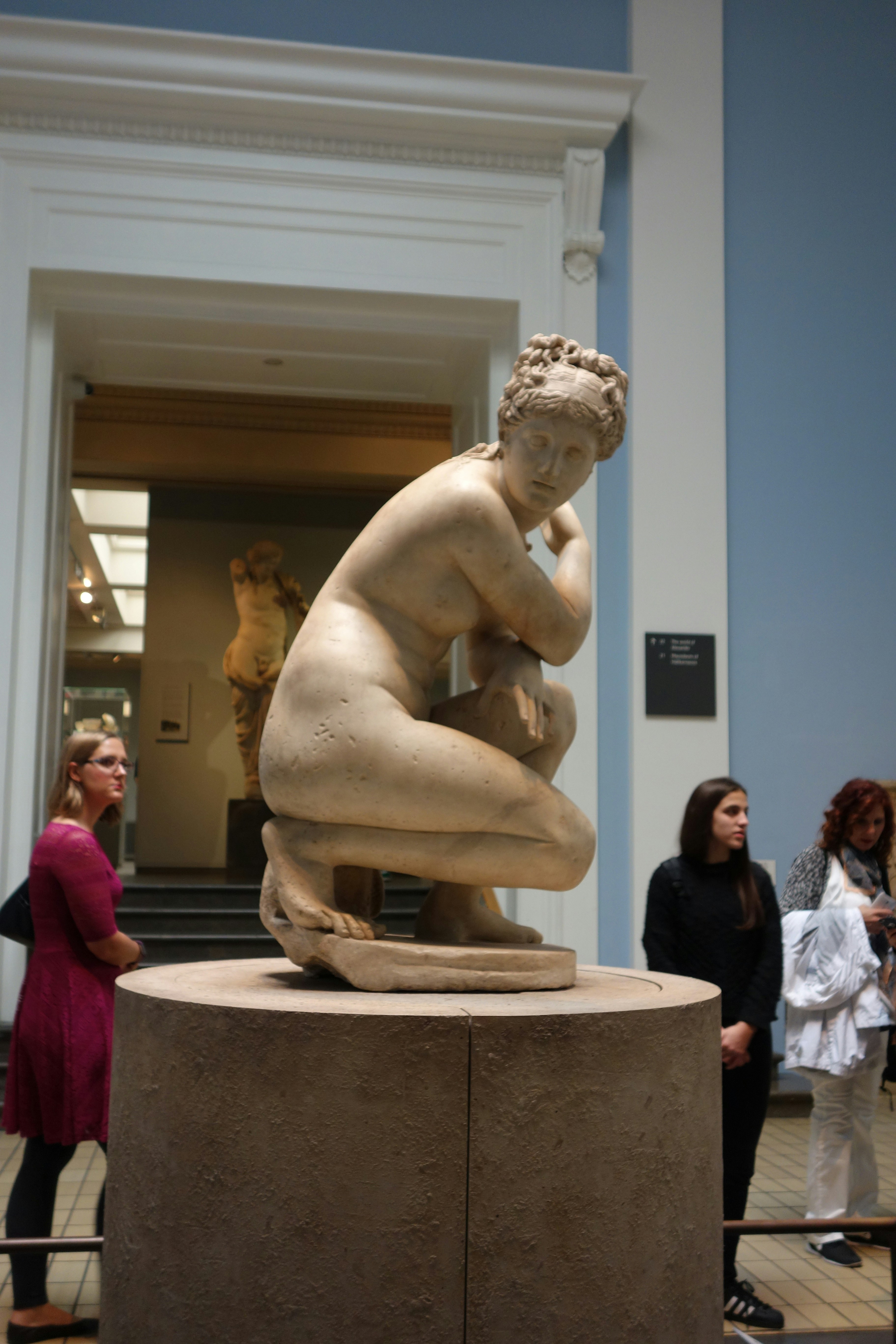 Kneeling Silence: Marble Contemplation in a Modern Gallery