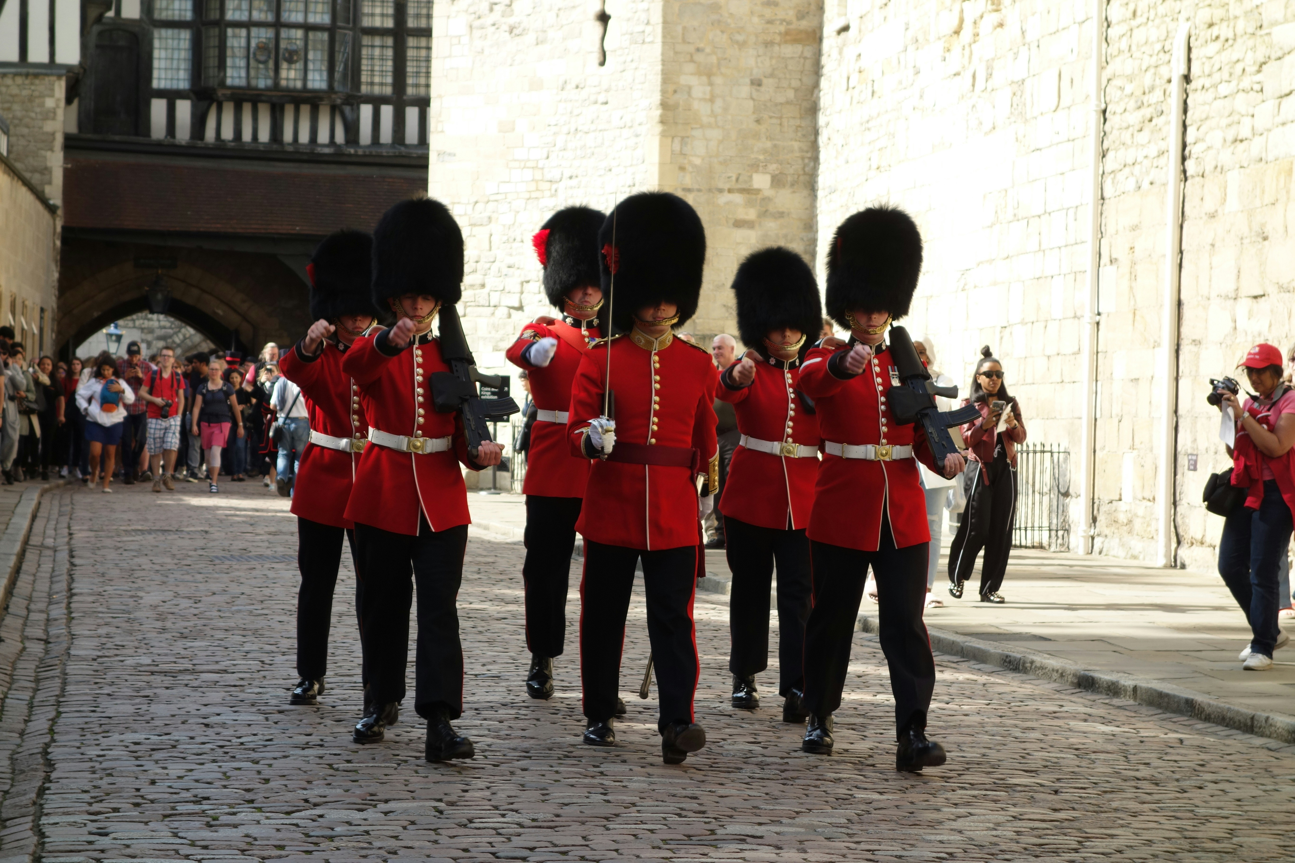 Marching in Red: Ceremonial Guards Under the Arch