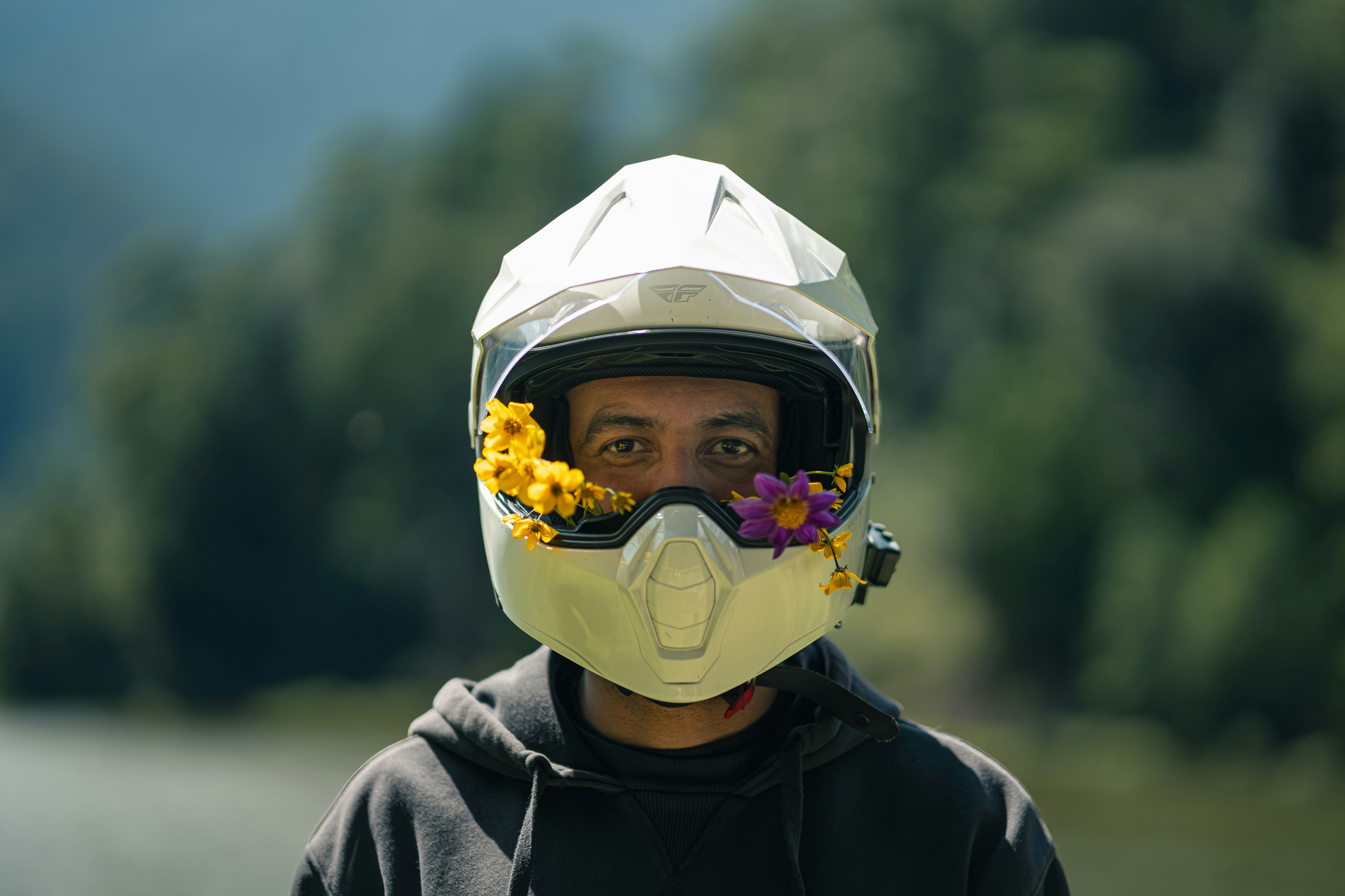 Petals in the Visor: A Quiet Portrait of a Rider on the Trail