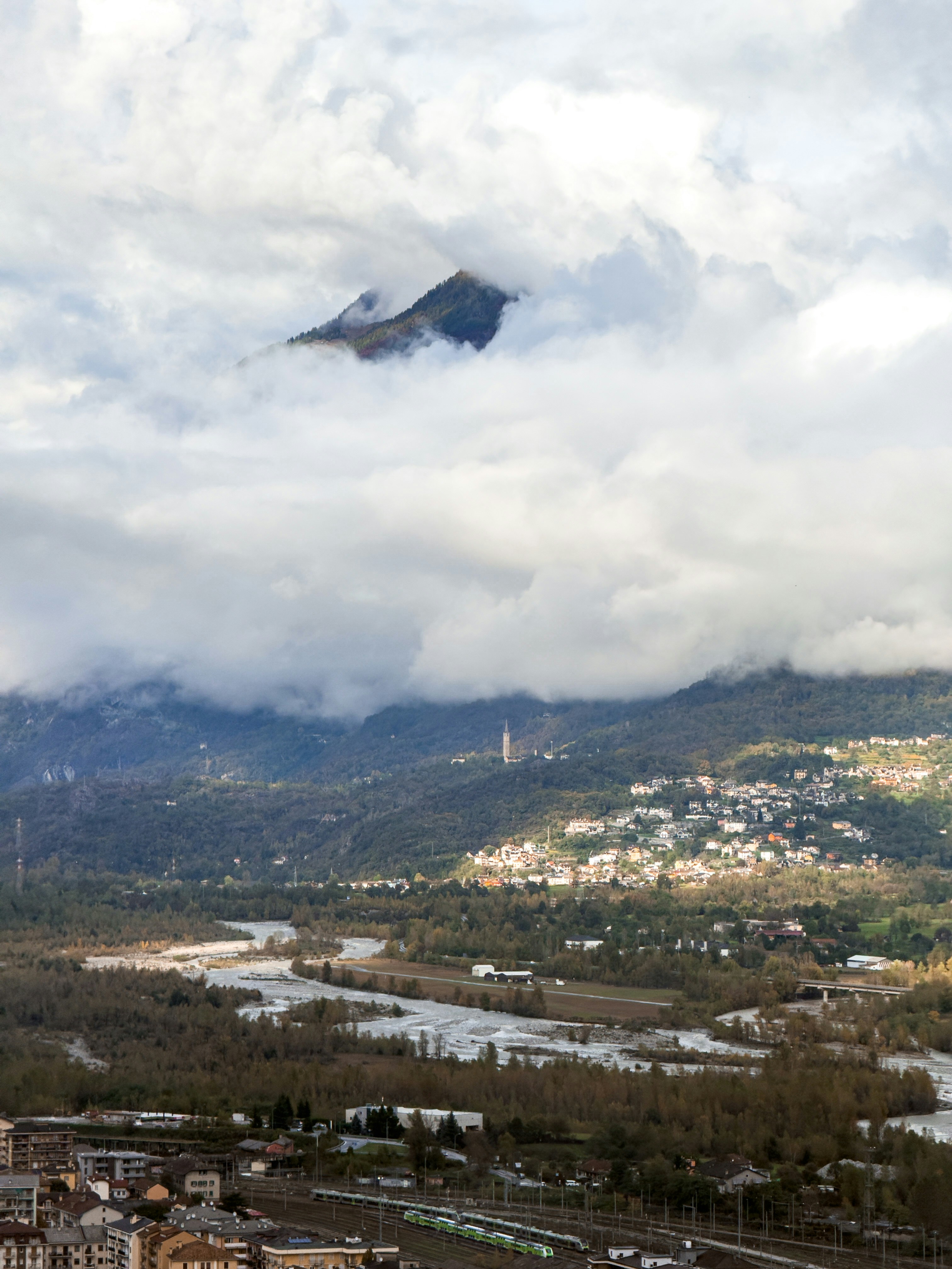 Veiled Peaks Above the Valley