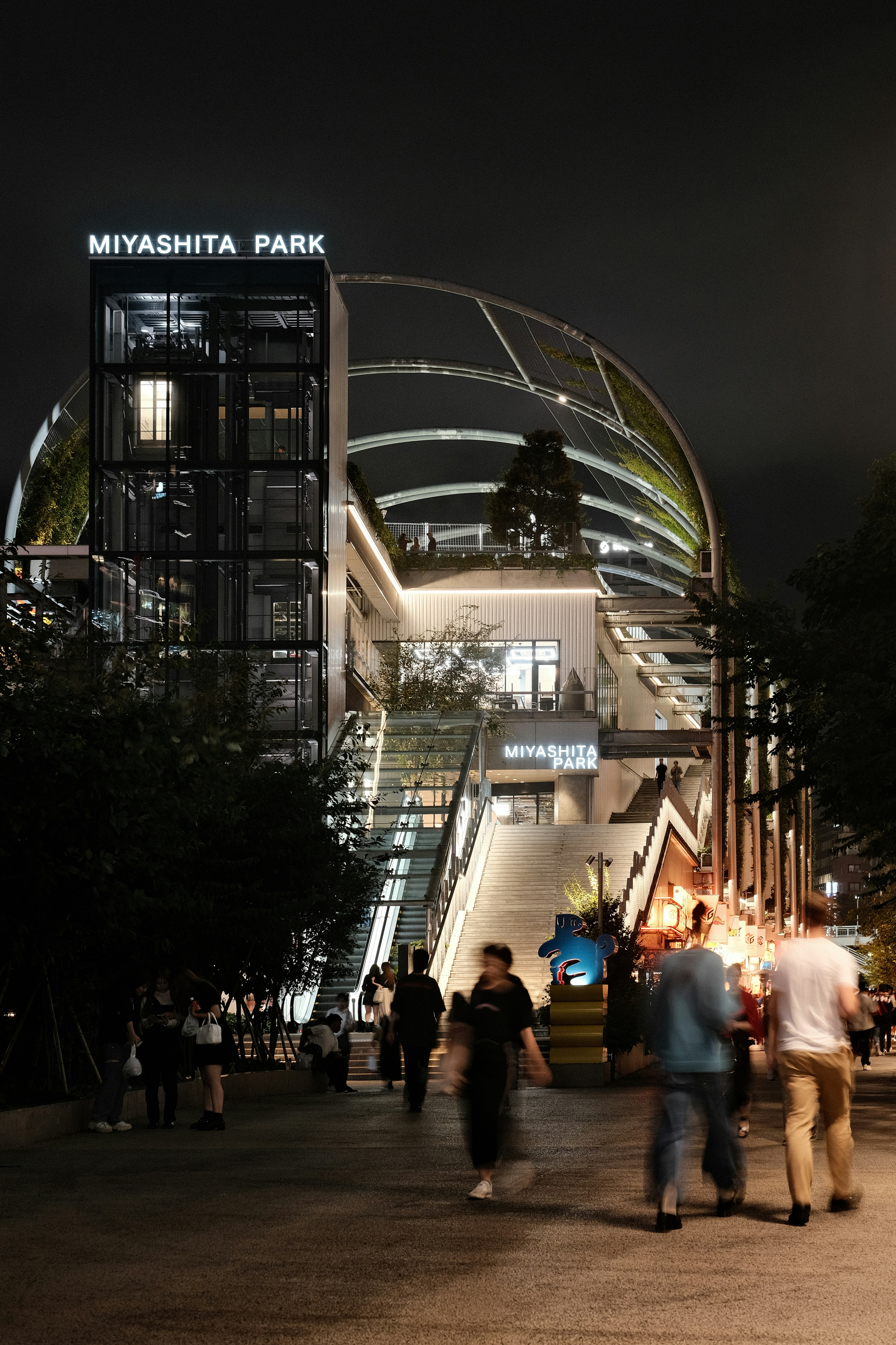 Night Ascent through Miyashita Park's Glass Arcade
