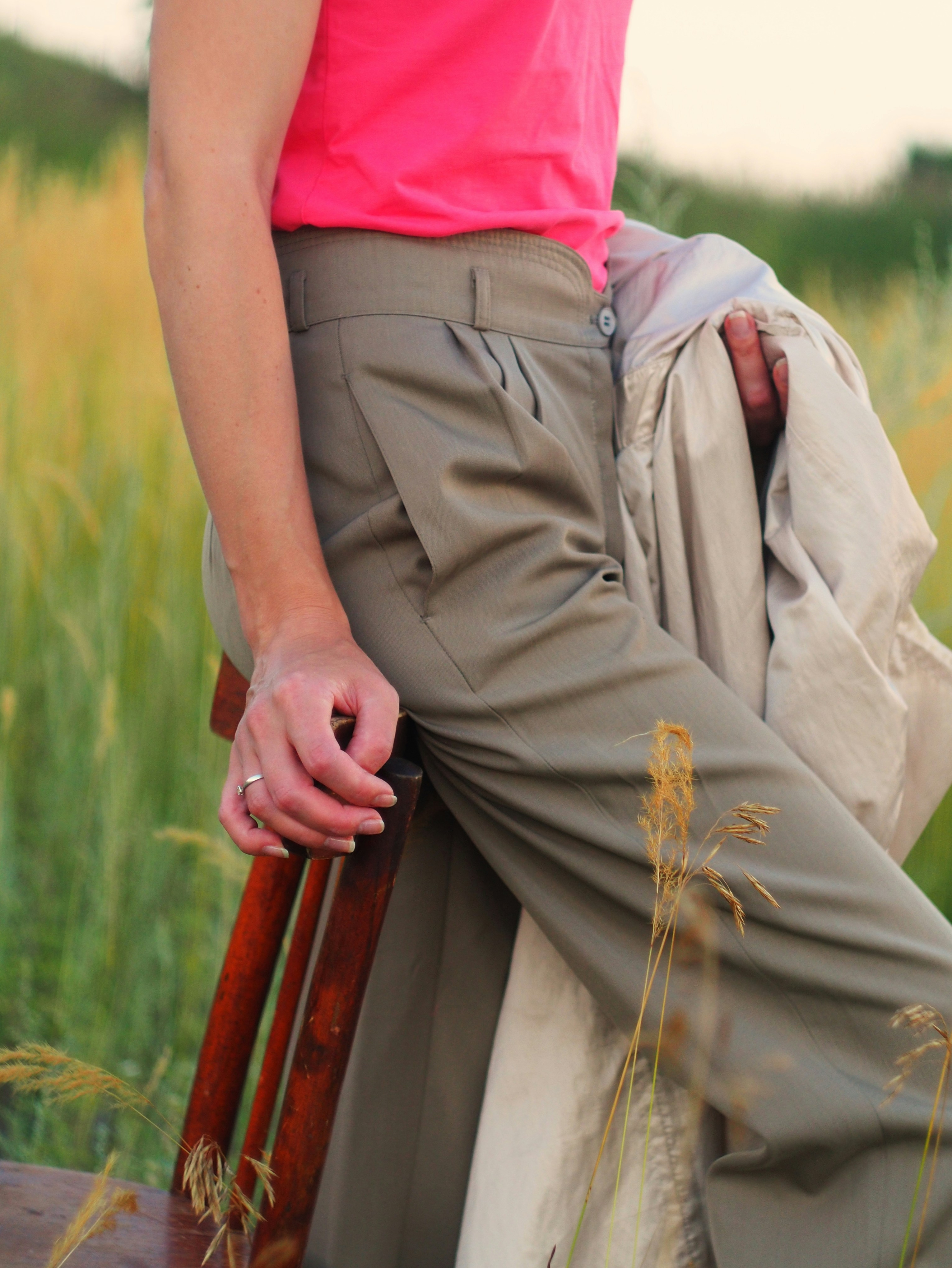 Pastel Quietude: Portrait on a Weathered Chair in a Field