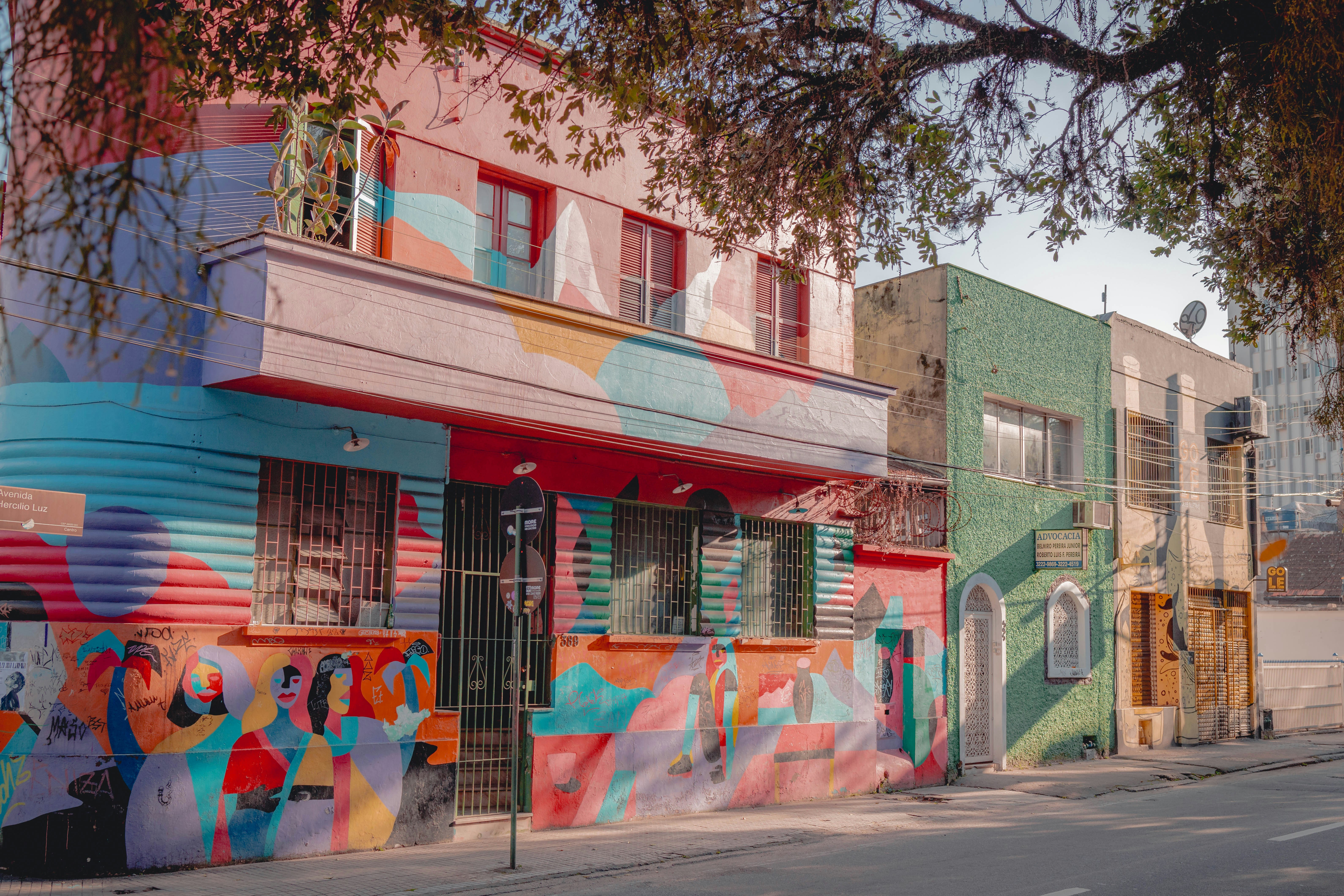 Chromatic Facade Trail: A sunlit mural-lined street