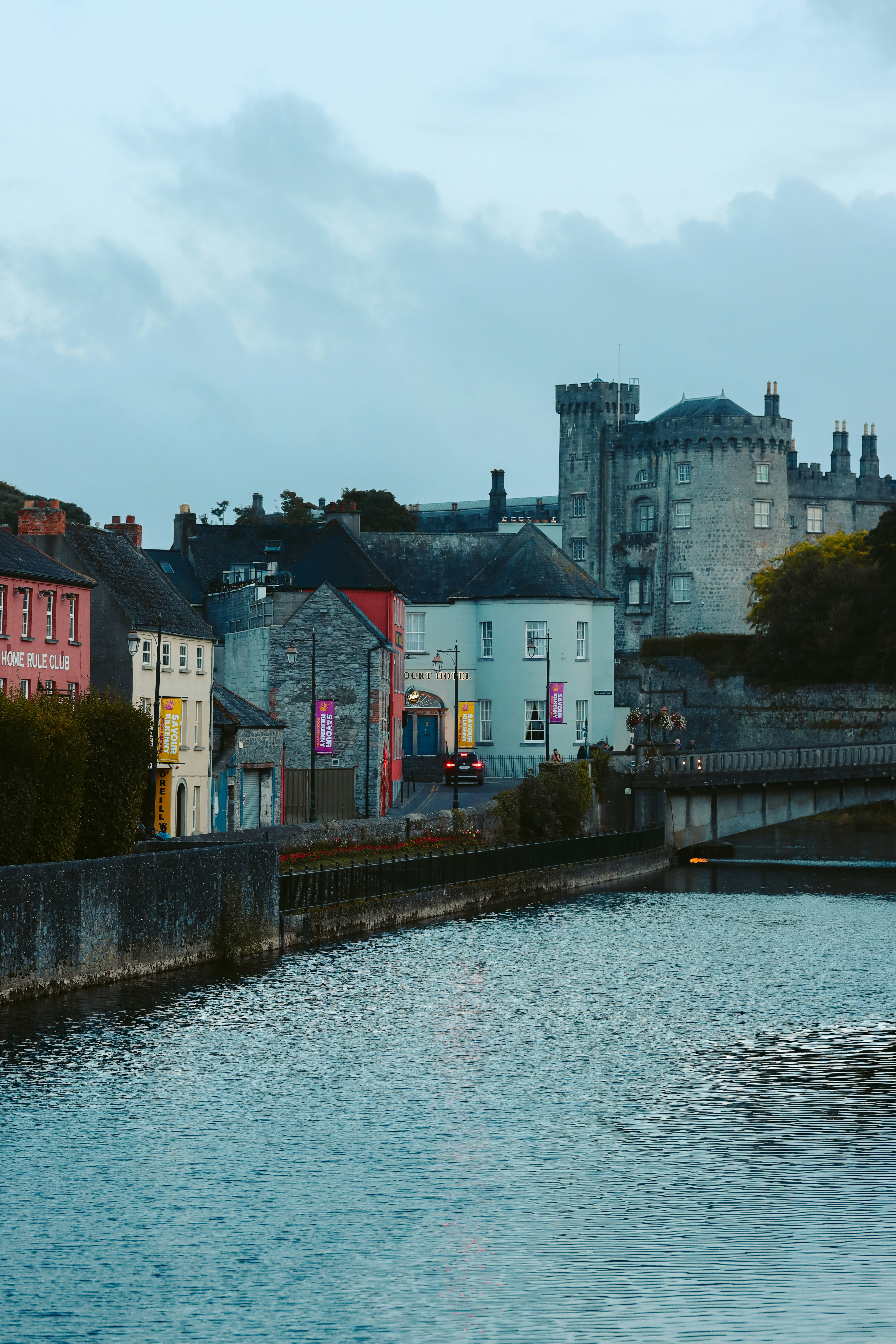 A river running through a city next to tall buildings photo – Free City ...