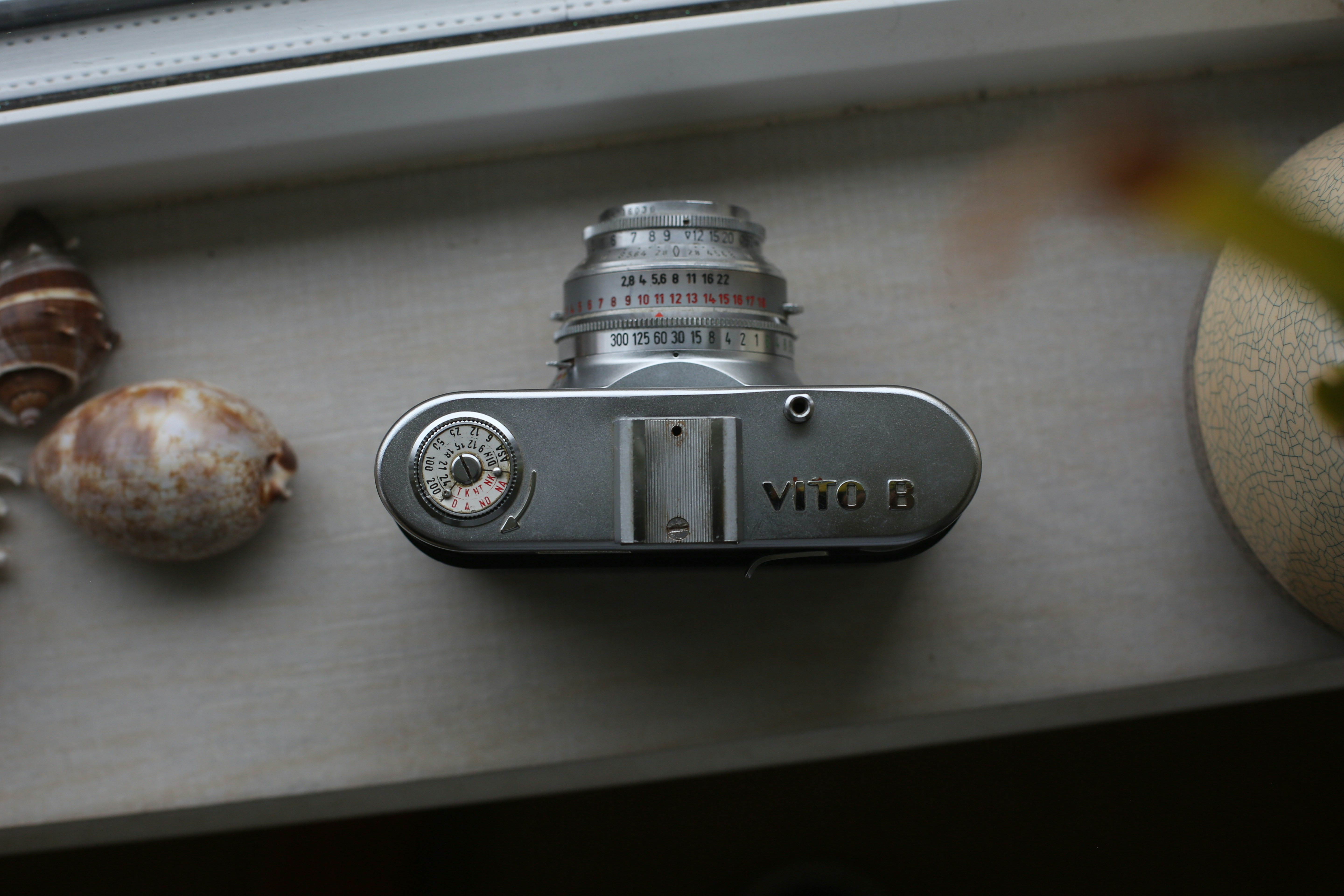 A close up of a camera on a window sill photo – Free Camera Image on ...